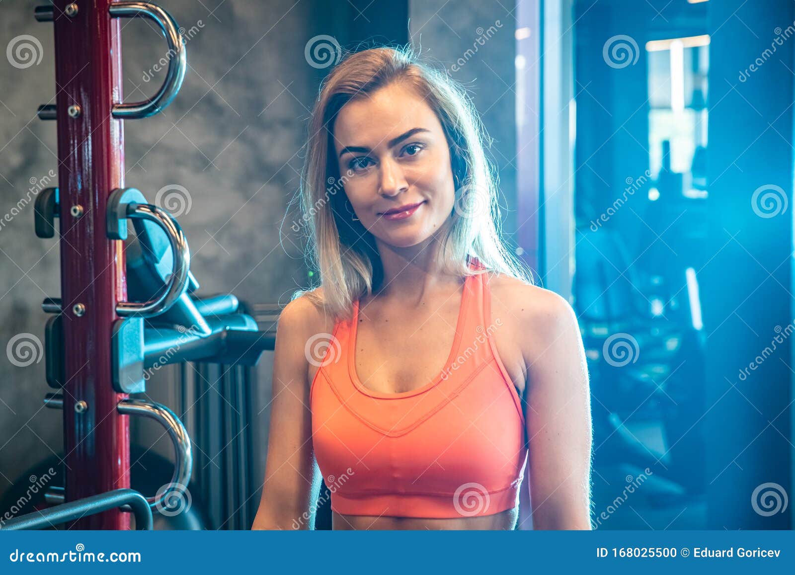 Fitness Model in Gym with Blue Light in Background Stock Photo - Image ...