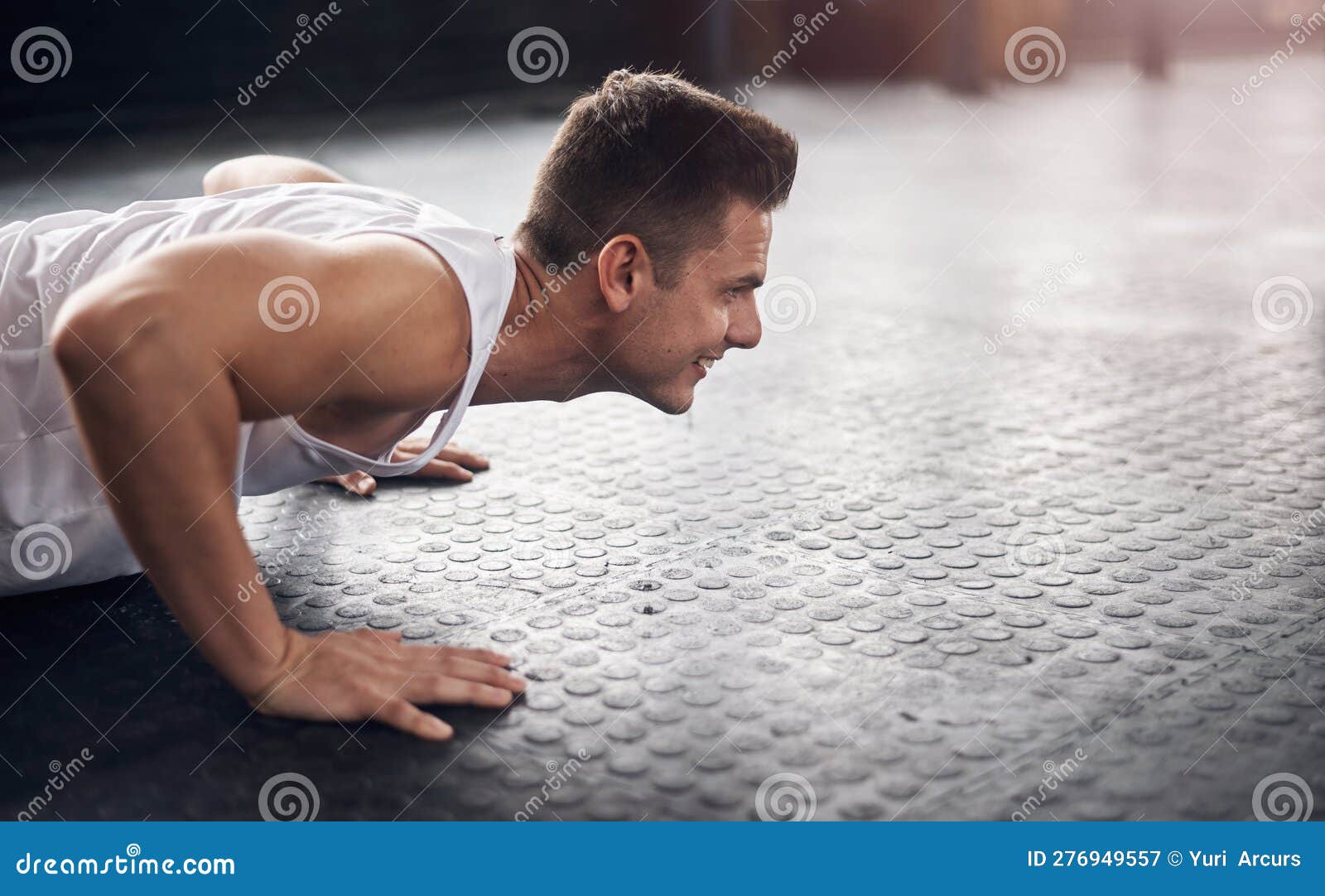 Fitness Starts with that First Push. a Young Man Doing Pushups in a Gym ...