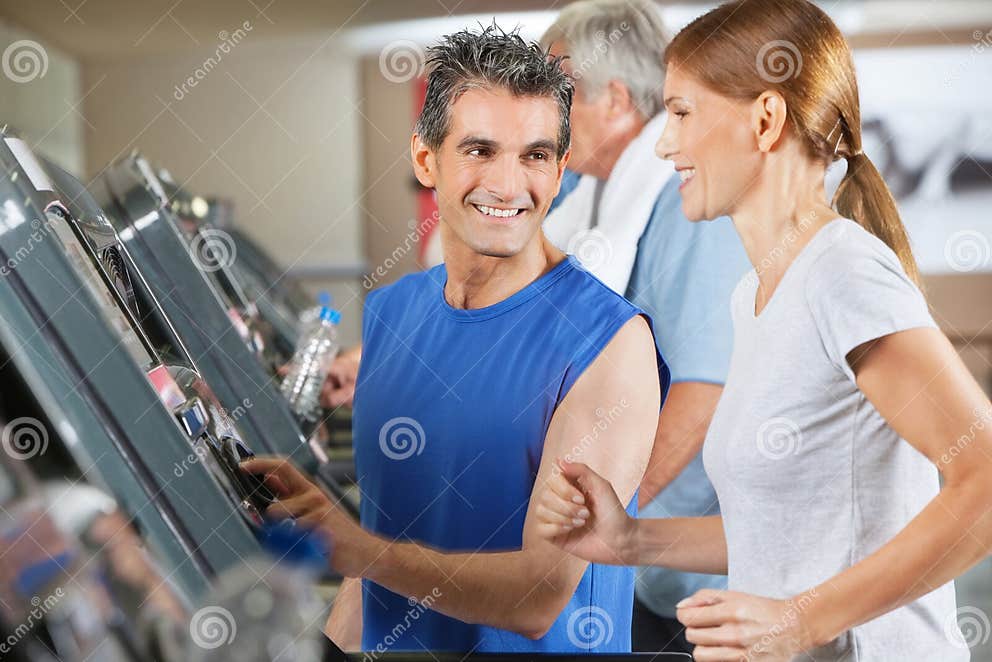 Fitness trainer explaining stock photo. Image of caucasian - 23996510
