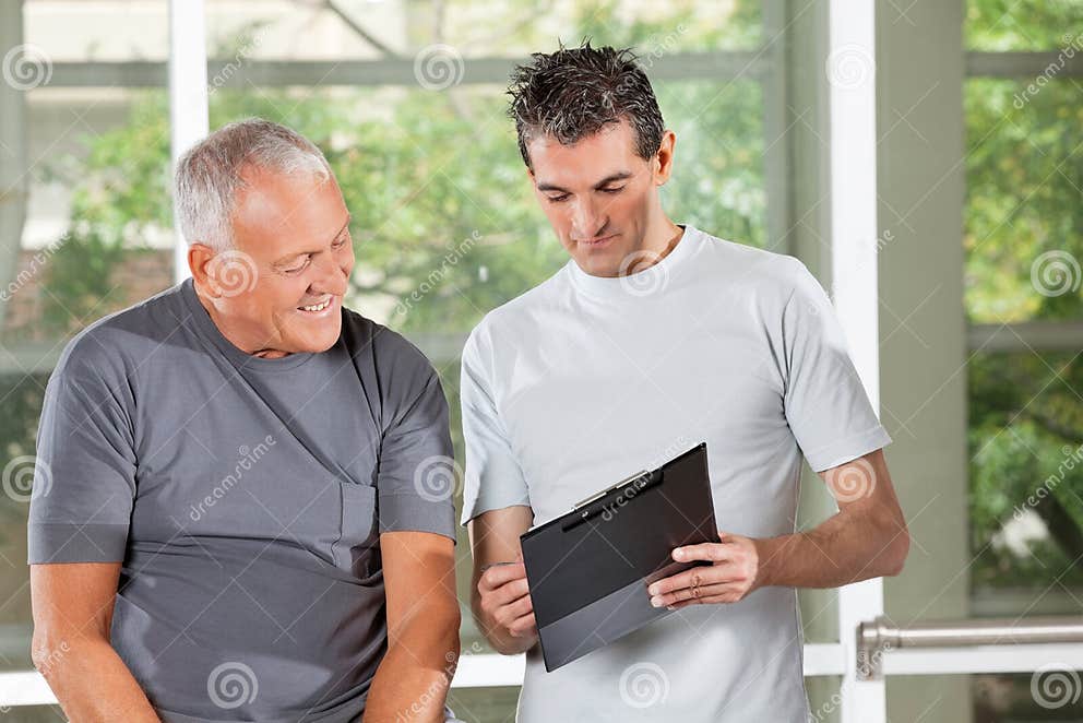 Fitness Trainer Explaining Training Stock Image - Image of coach ...