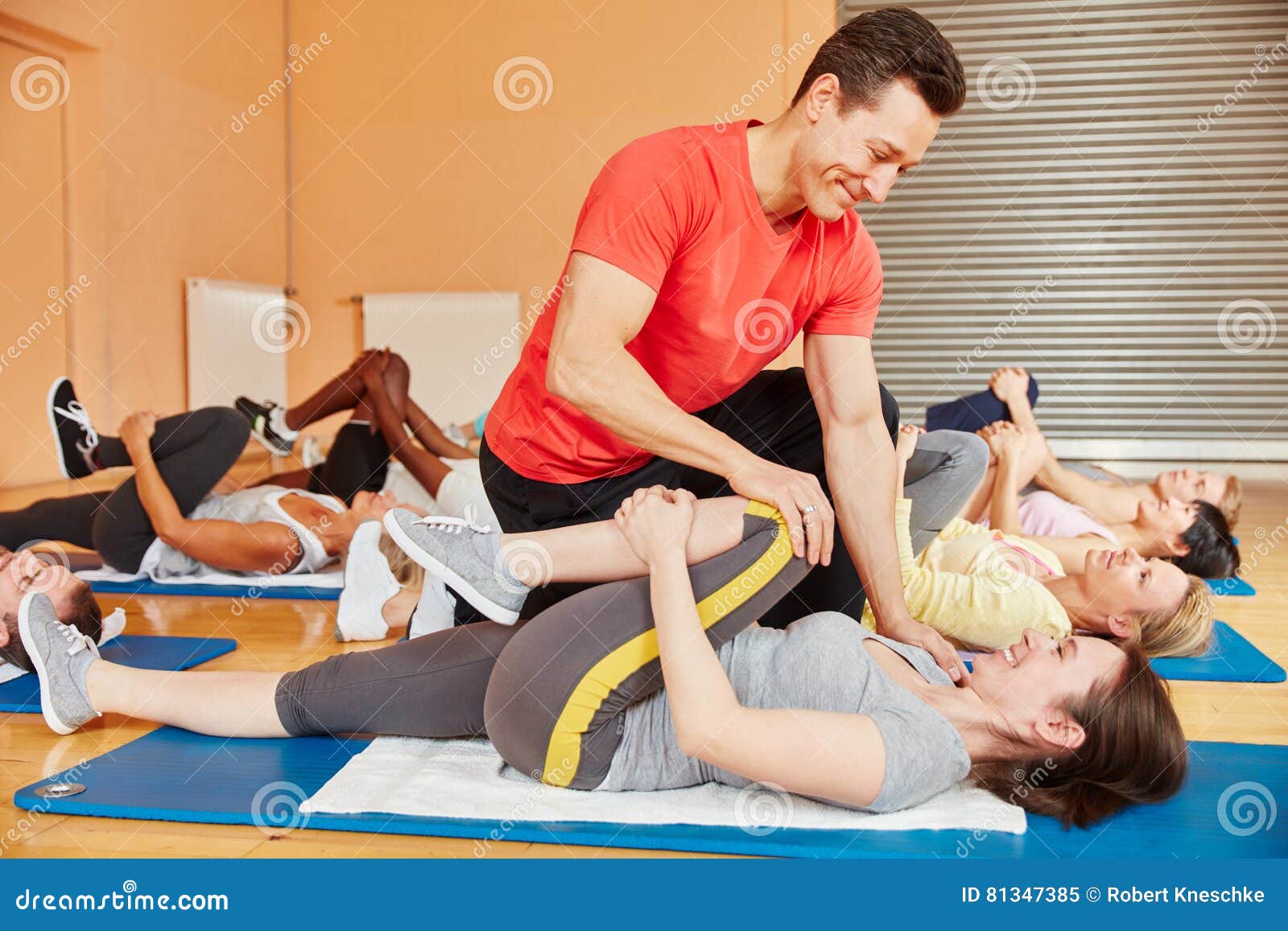 Fitness Trainer Helping with Gymnastics Exercise Stock Image - Image of ...