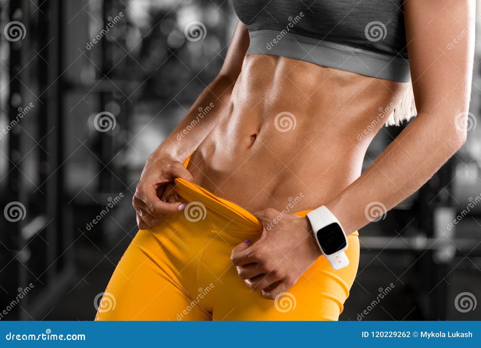 Fitness Woman Showing Abs And Flat Belly Beautiful Muscular Girl
