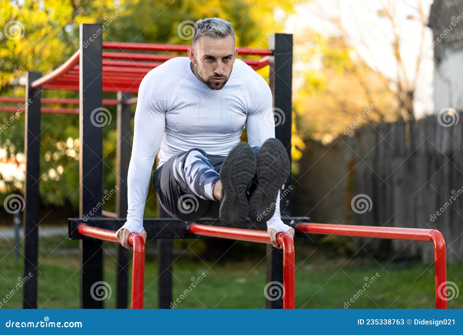 Fitness Workout for Frontal Abs on Parallel Bars, Young Man Working Out ...