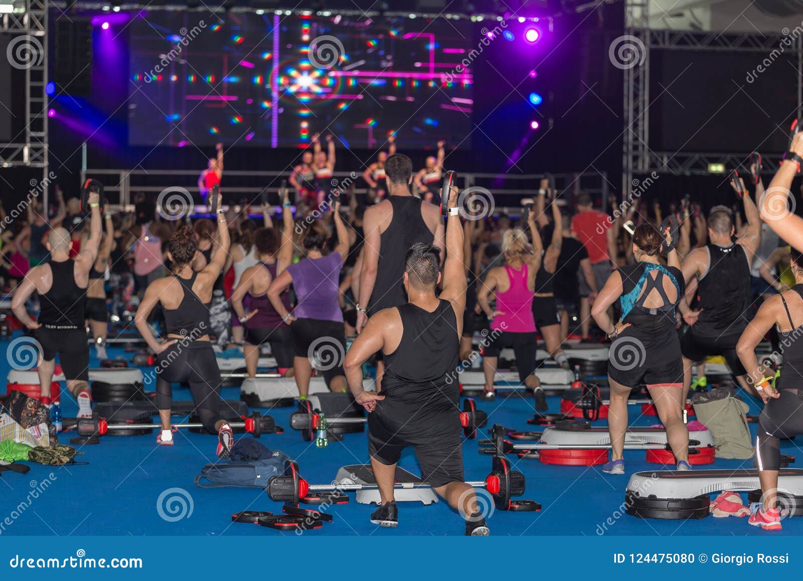 Fitness Workout in Gym: People Doing Exercises in Class with Step ...
