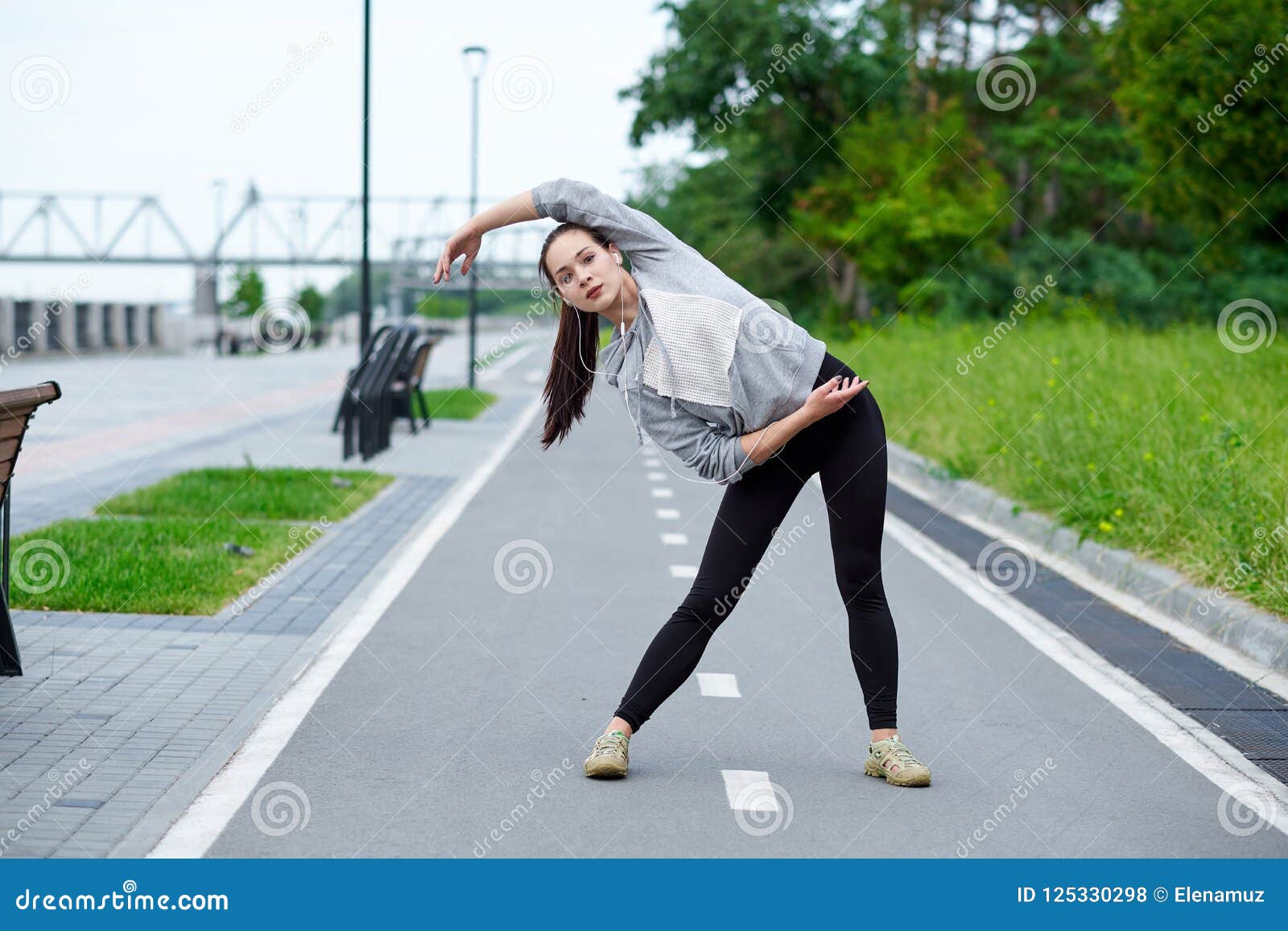 Fitness Young Asian Woman Stretching Legs After Run Outdoors After Run