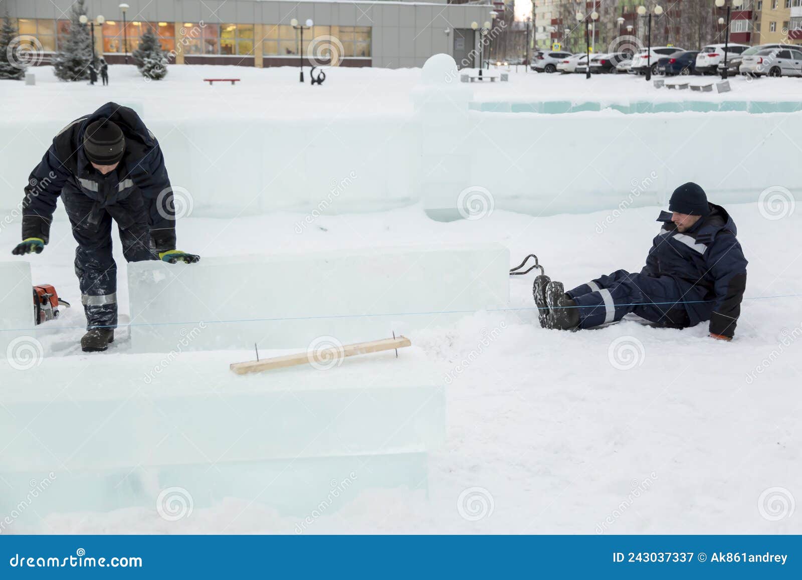 The Fitters are Trying To Move the Ice Block with Their Hands and Feet ...