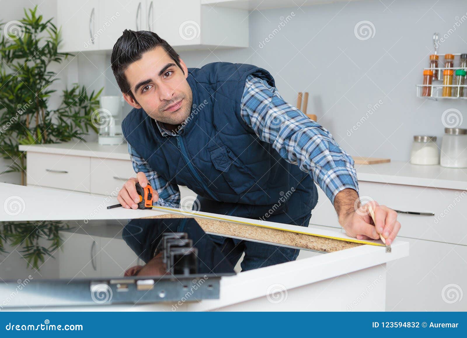 Fitting a new cooker stock photo. Image of installation - 123594832