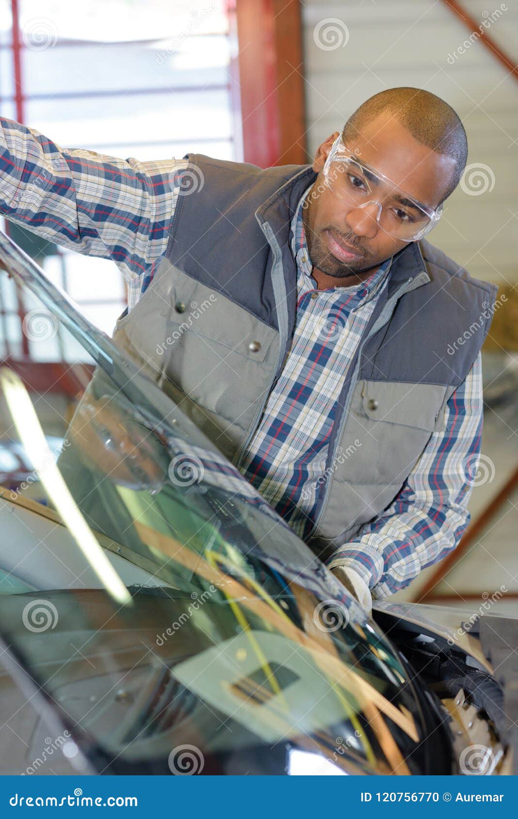 Fitting the new windshield stock photo. Image of duty - 120756770