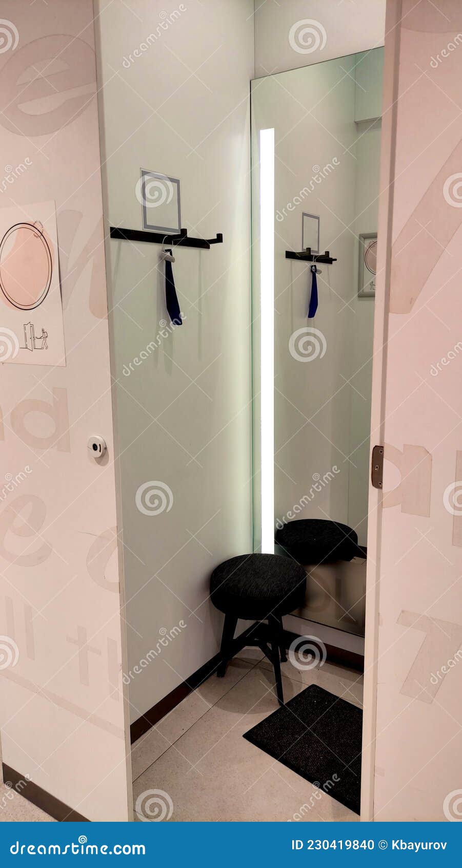 Fitting Room Empty with Mirror and Clothes Hanger Stock Photo - Image ...