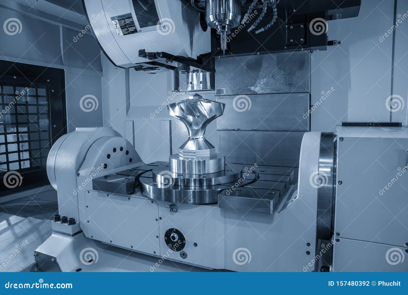 The Five Axis Machining Center Cutting the Mechanical Parts with the ... The Five Axis Machining Center Cutting the Mechanical Parts with the ...