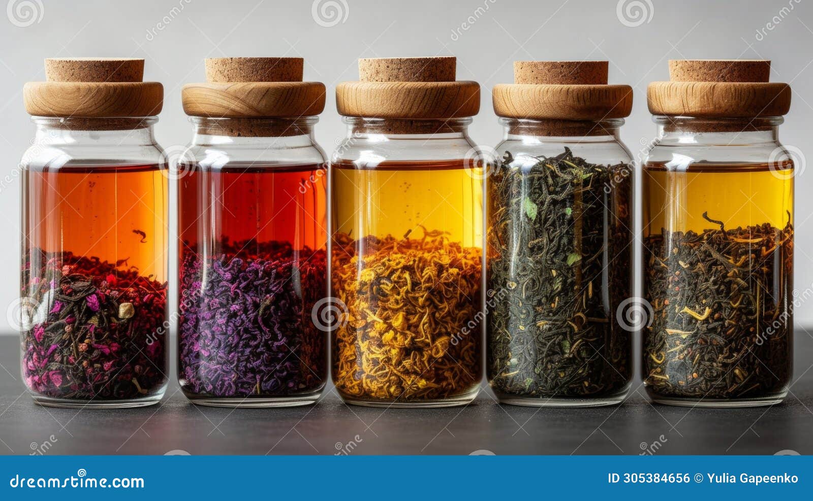 Five Beautiful Glass Jars with Tea Standing in a Row Stock Photo ...