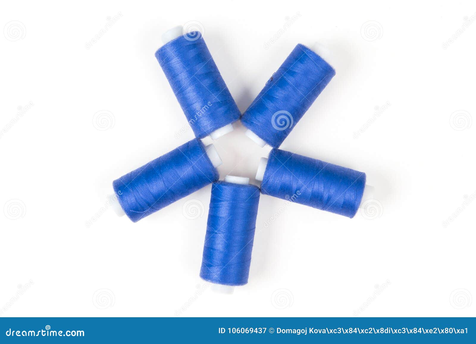 Five Blue Sewing Threads Laying in a Circle on a White Background ...