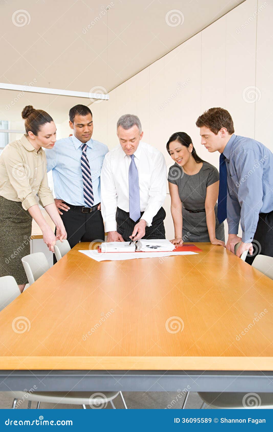 Five Colleagues Around a Desk Stock Image - Image of babyboomer, aged ...