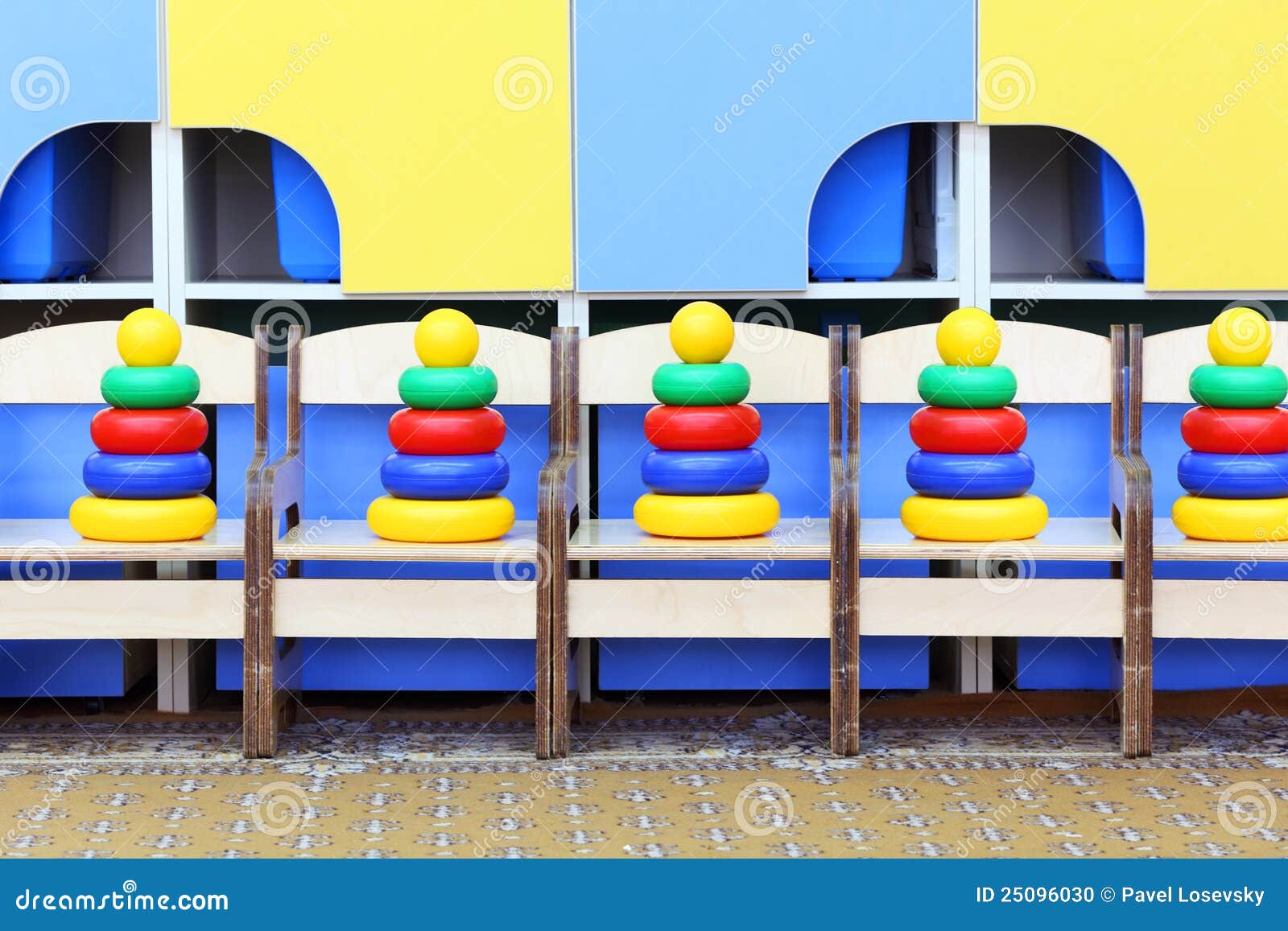 Five Colorful Pyramid Toys Stand at Chairs Stock Photo - Image of ...