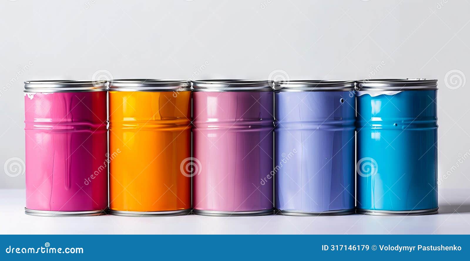 Five Colorful Tin Cans Lined Up on a White Surface Stock Image - Image ...
