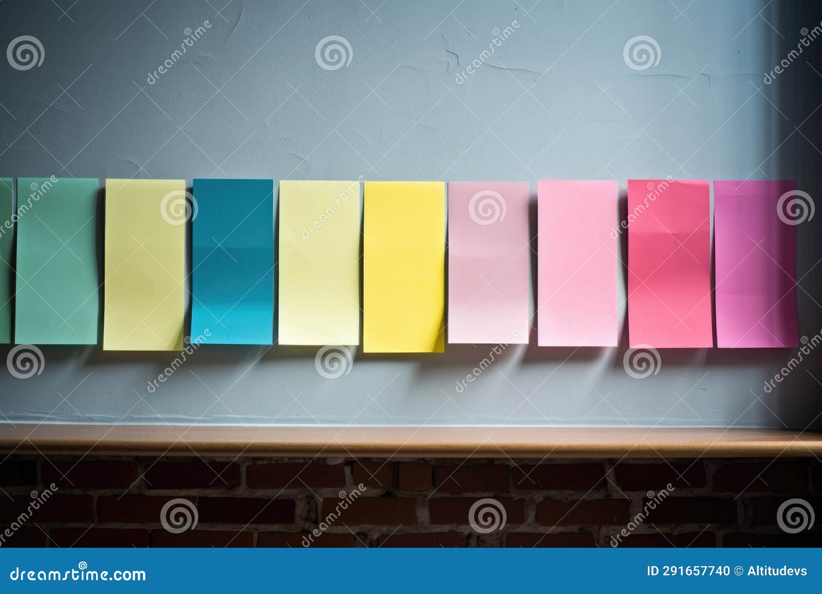 Five Colors of Sticky Notes Placed on a Wall in a Row Stock Photo ...