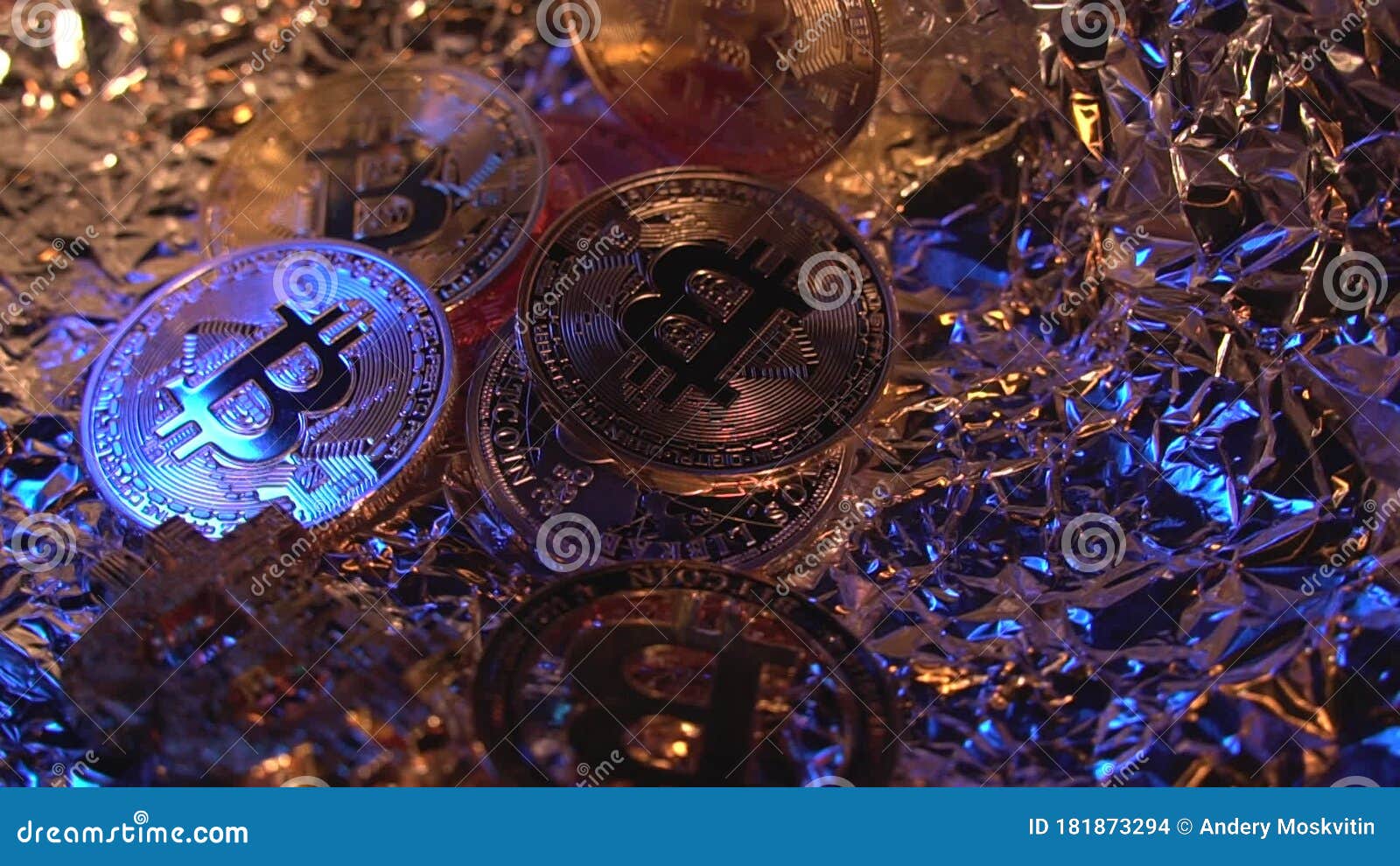 Five Cripto Coins Bitcoin BTC Rotate on the Table with Gold and Blue ...