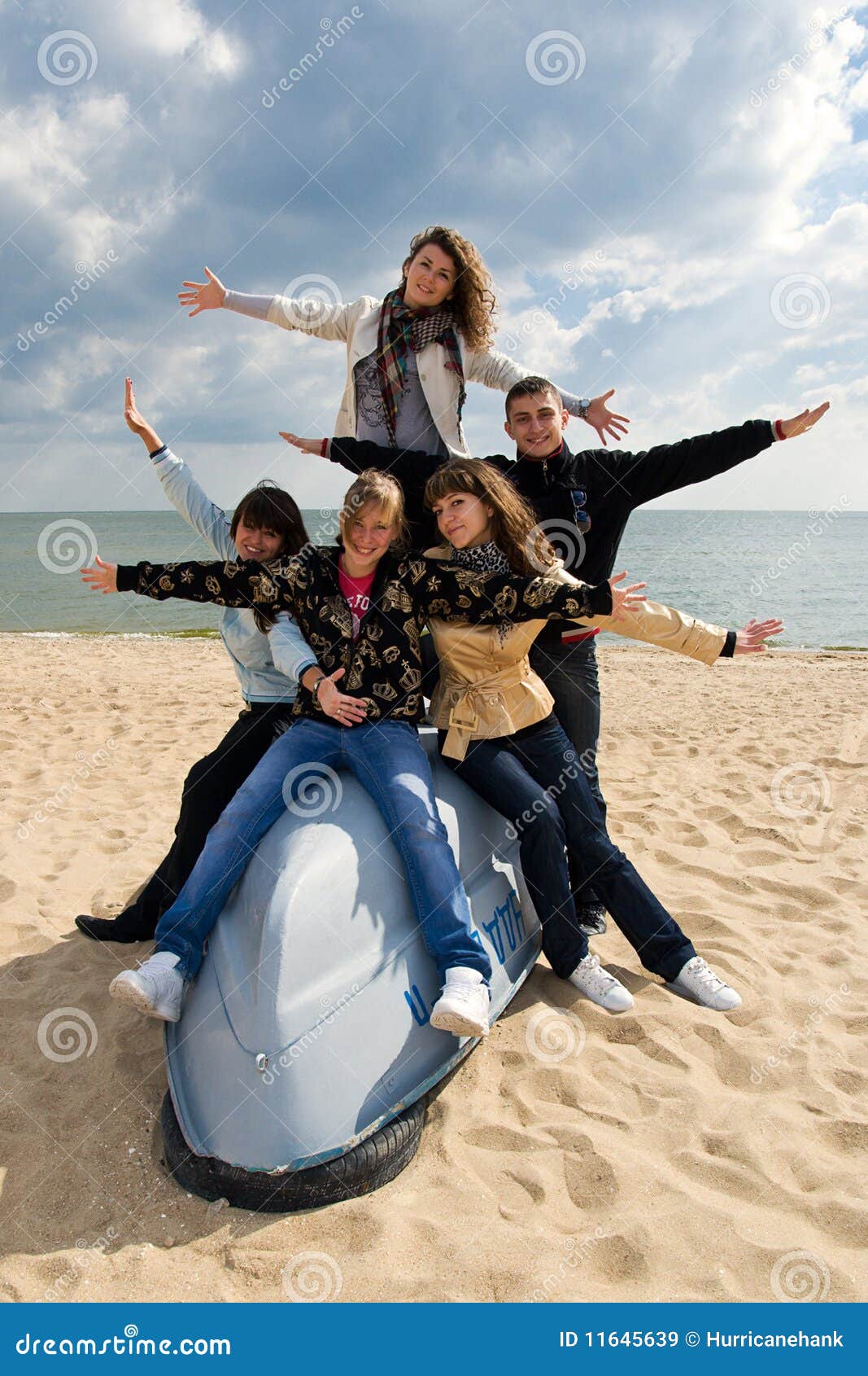 Five friends on the boat stock image. Image of beach - 11645639