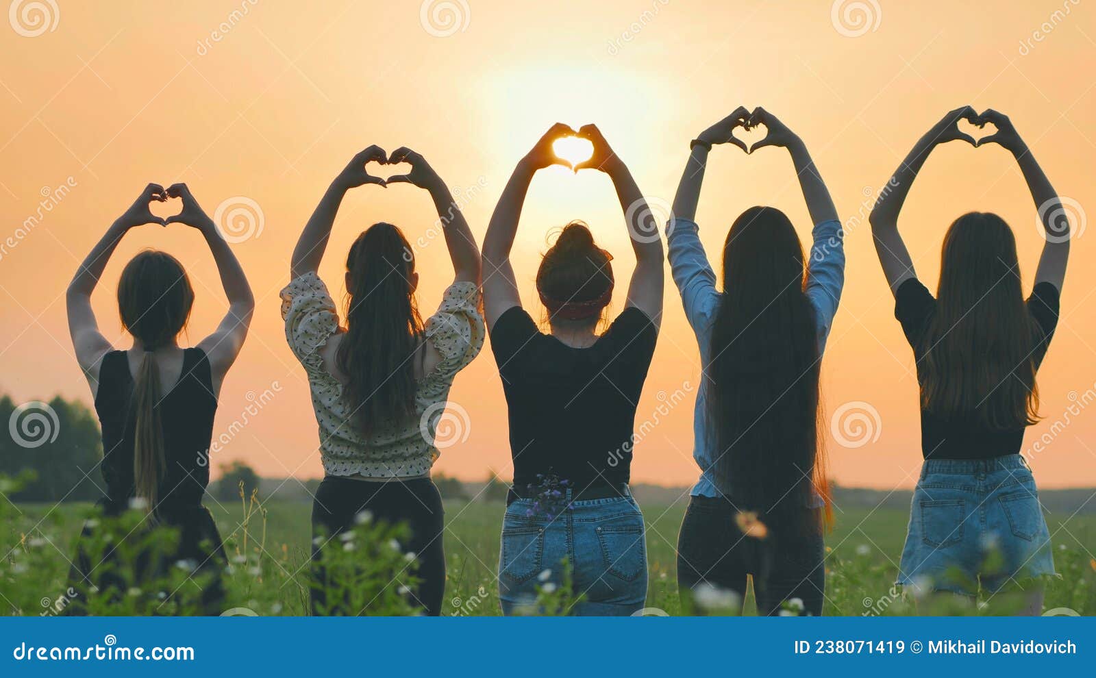 Five Girls Make a Heart Shape from Their Hands at Sunset. Stock Image ...