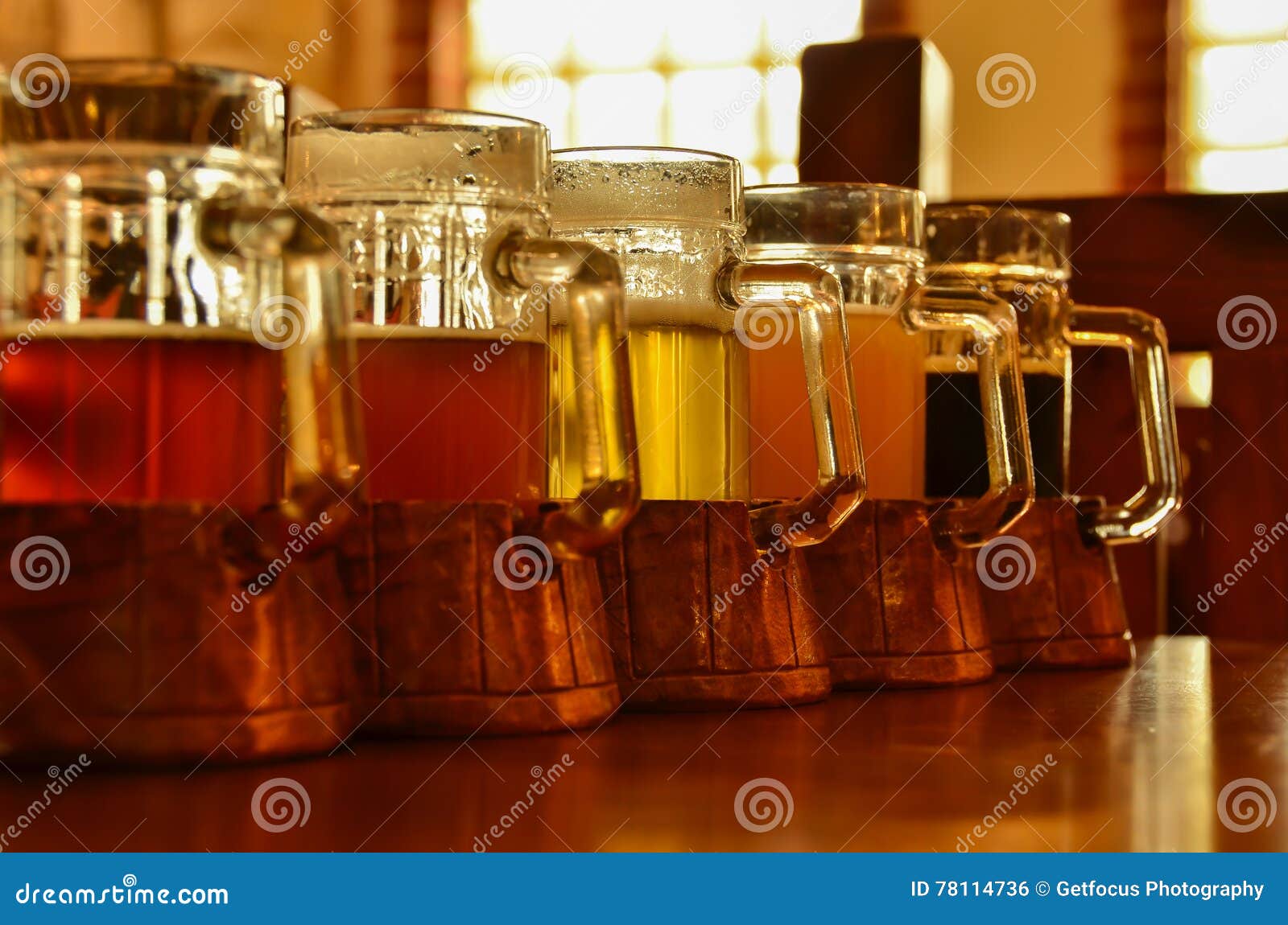 Five Glasses of Beer Stand in a Row on the Bar Table Stock Photo ...