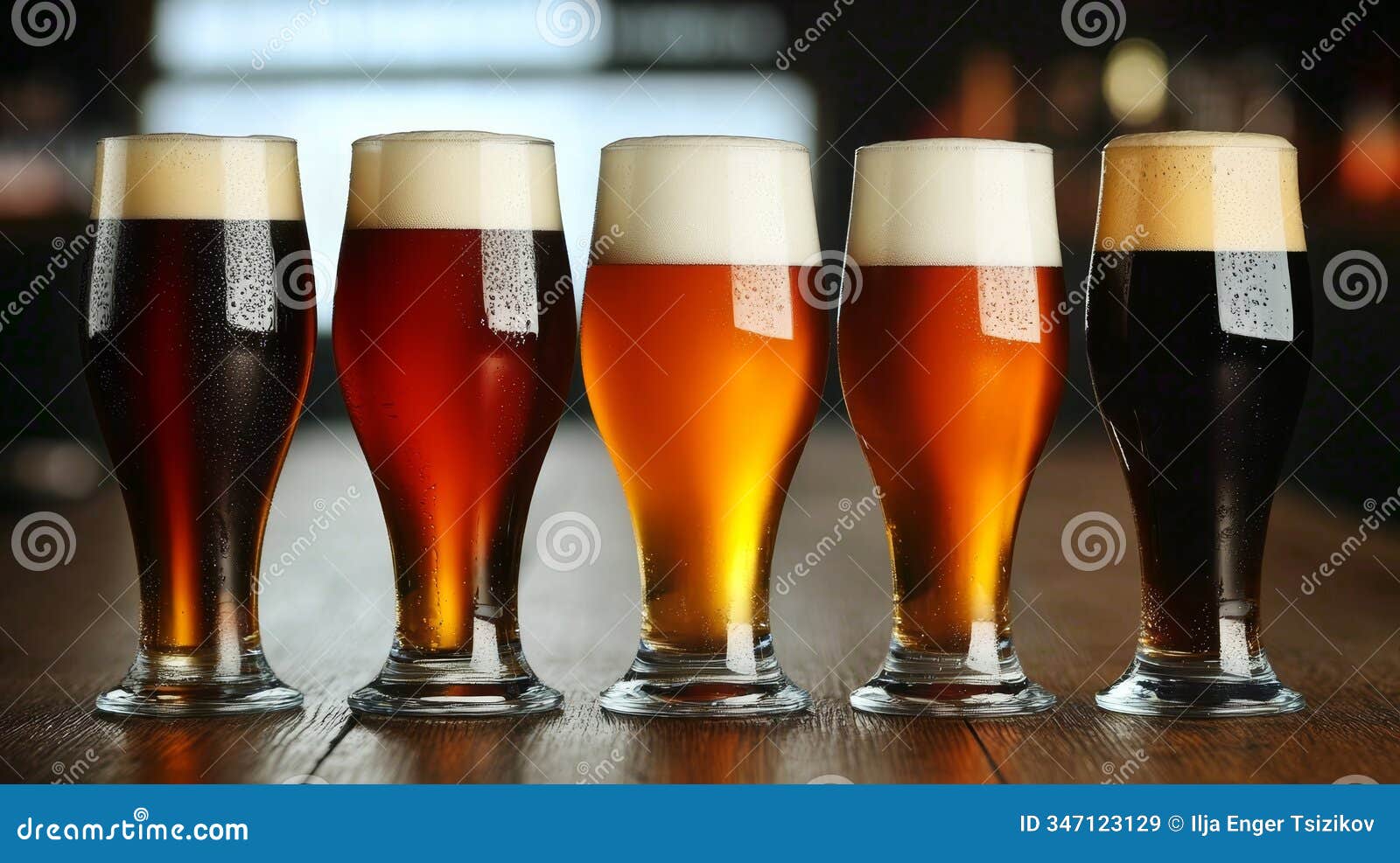 Five Glasses of Various Draft Beers on a Wooden Bar Counter with a ...