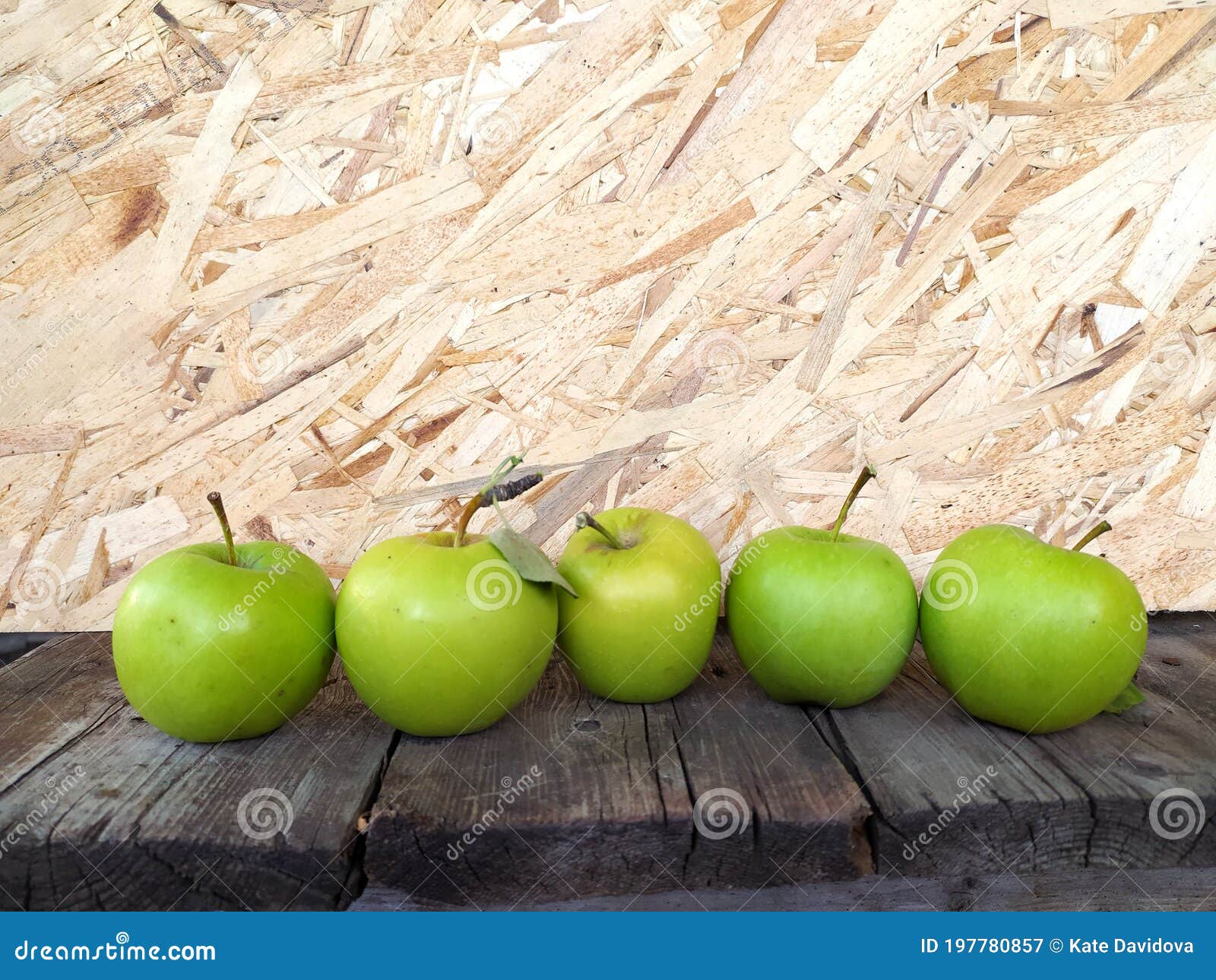 Five Green Apples in a Row on a Textured Wooden Table Stock Image ...