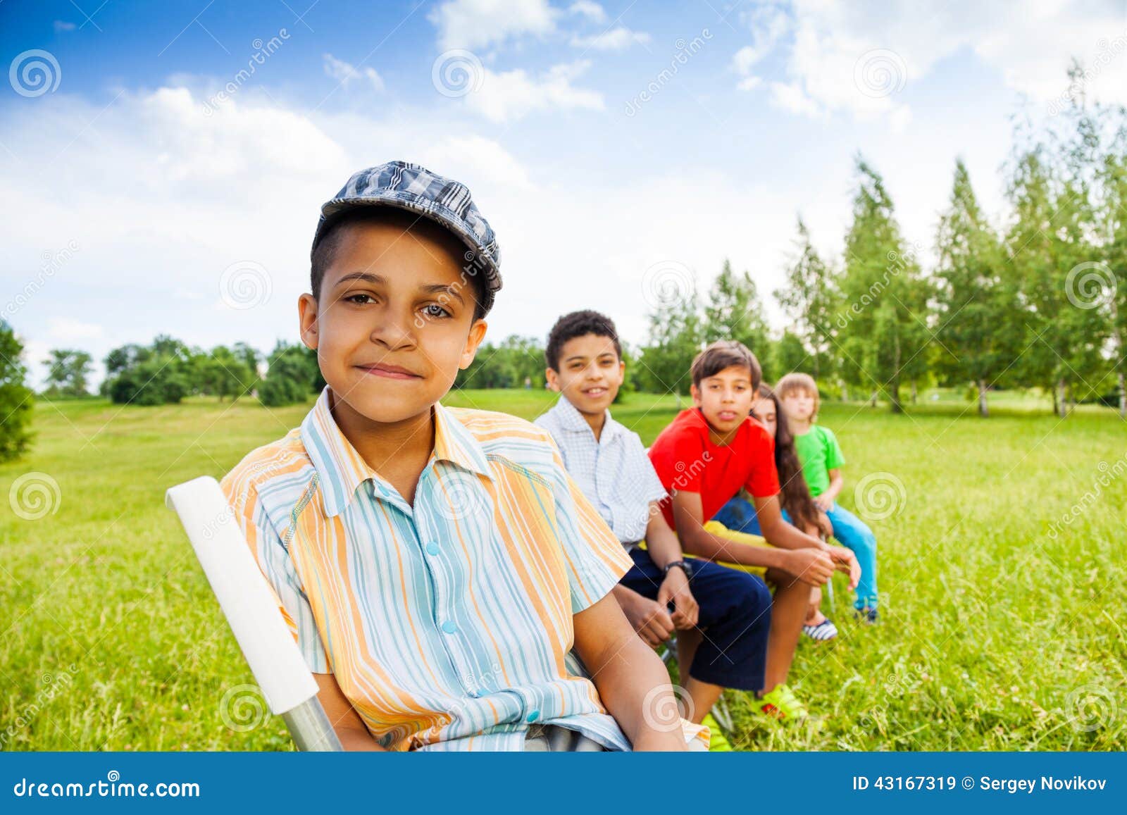 Five Happy Children Sit on Chairs in Row Outdoors Stock Image - Image ...