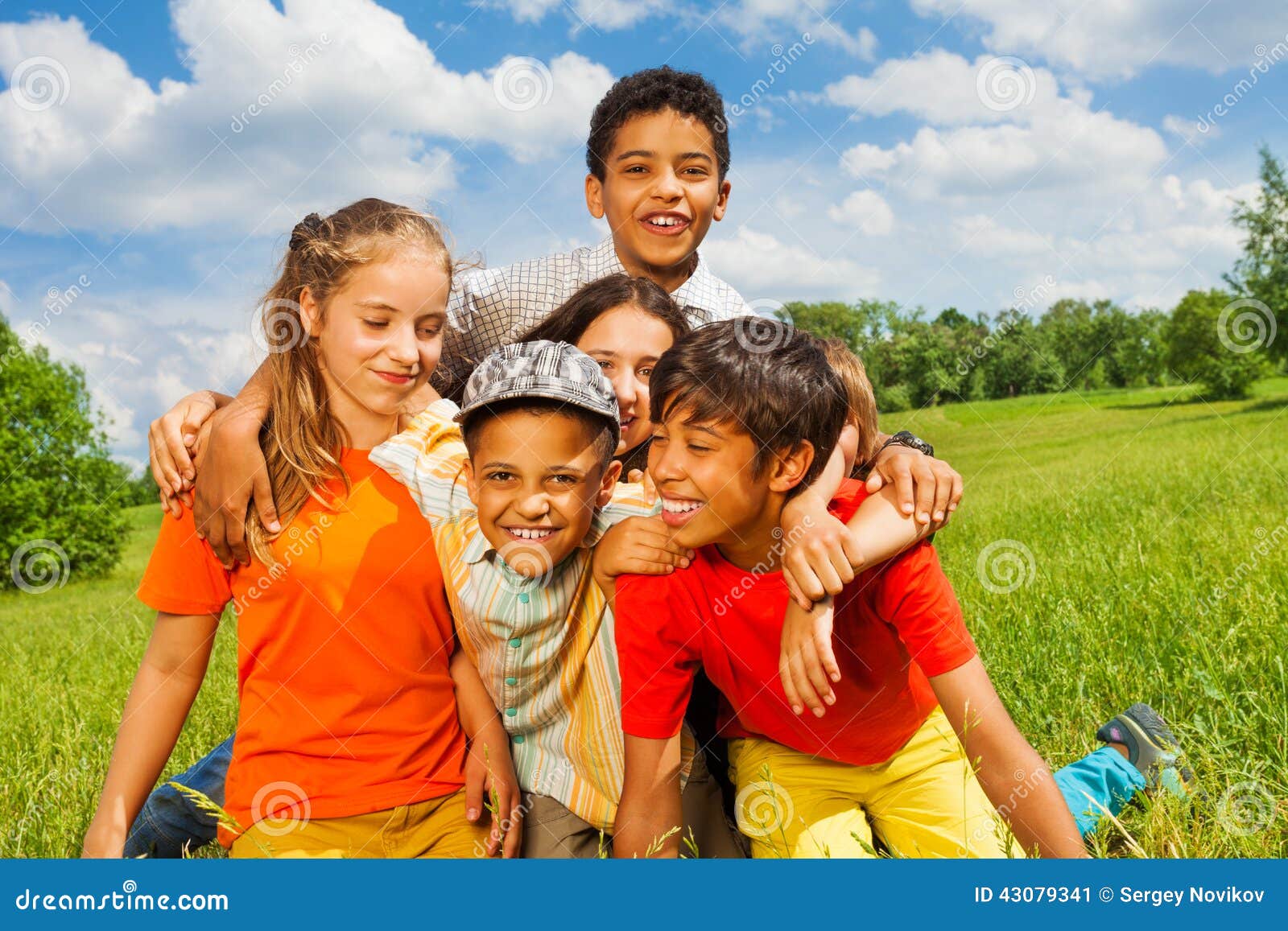 Five Happy Kids Cuddling Together Outside Stock Image - Image of ...