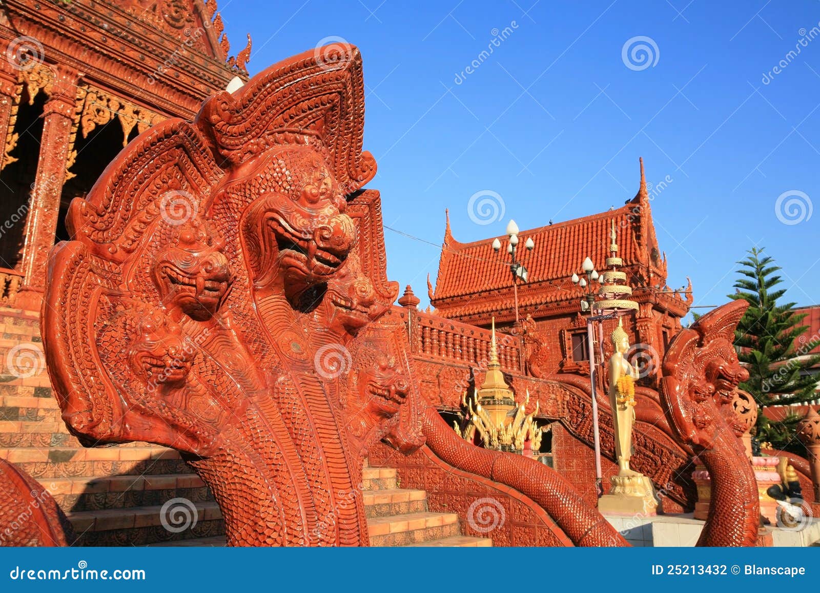 Five Head Snake Sculpture and Gold Buddha Statue Stock Photo - Image of ...