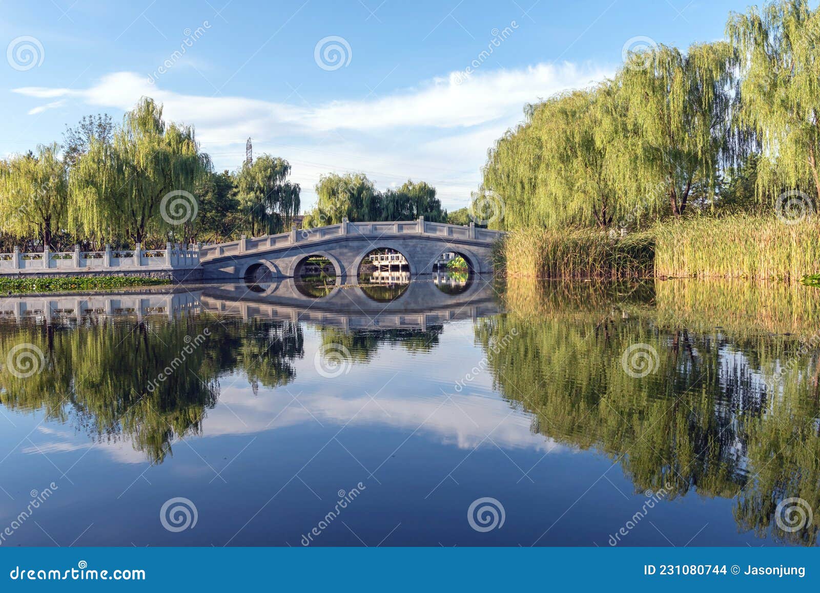 Five Hole Bridge Building with Reflection on Lake Stock Photo - Image ...