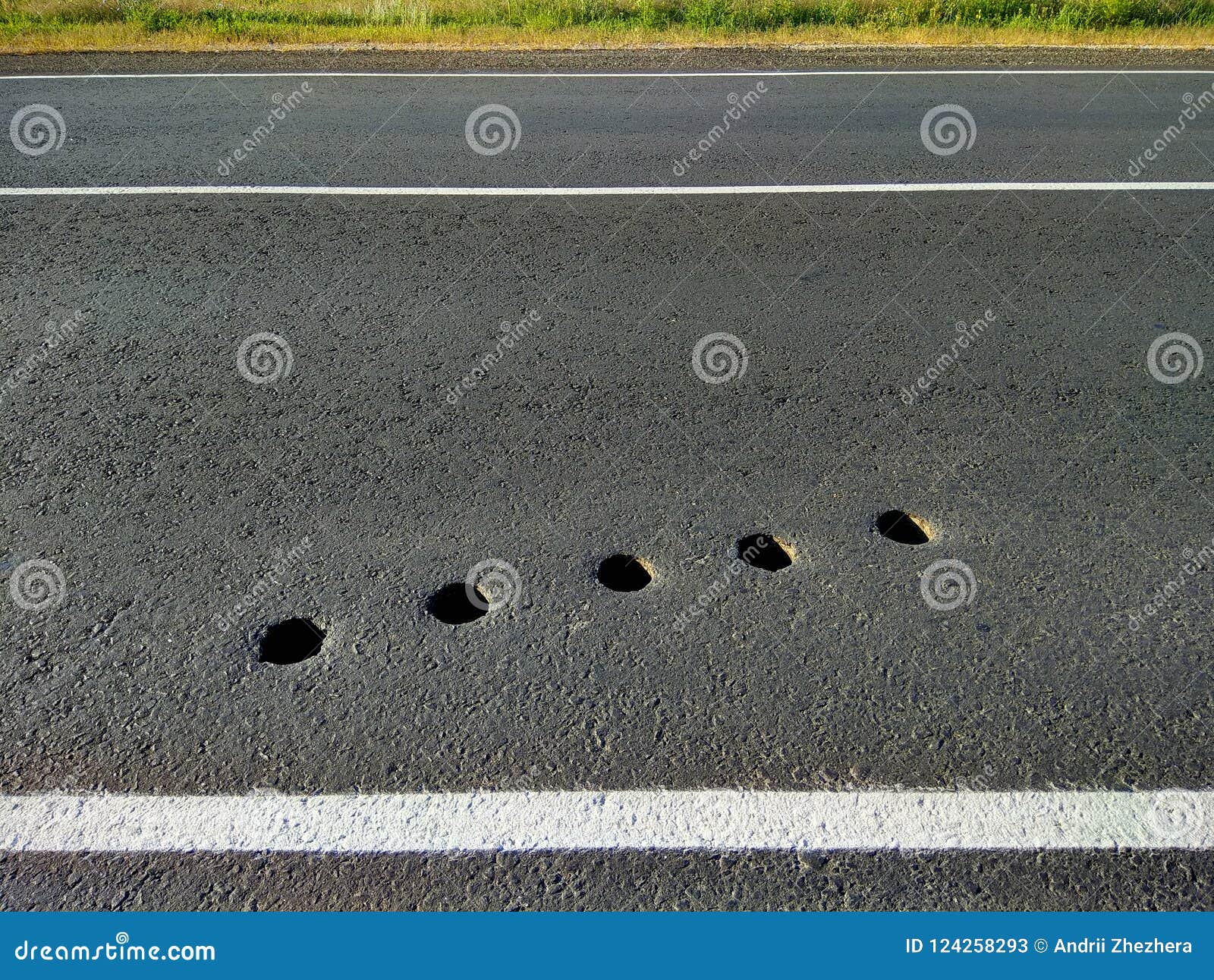 Five holes in asphalt road stock image. Image of marking - 124258293