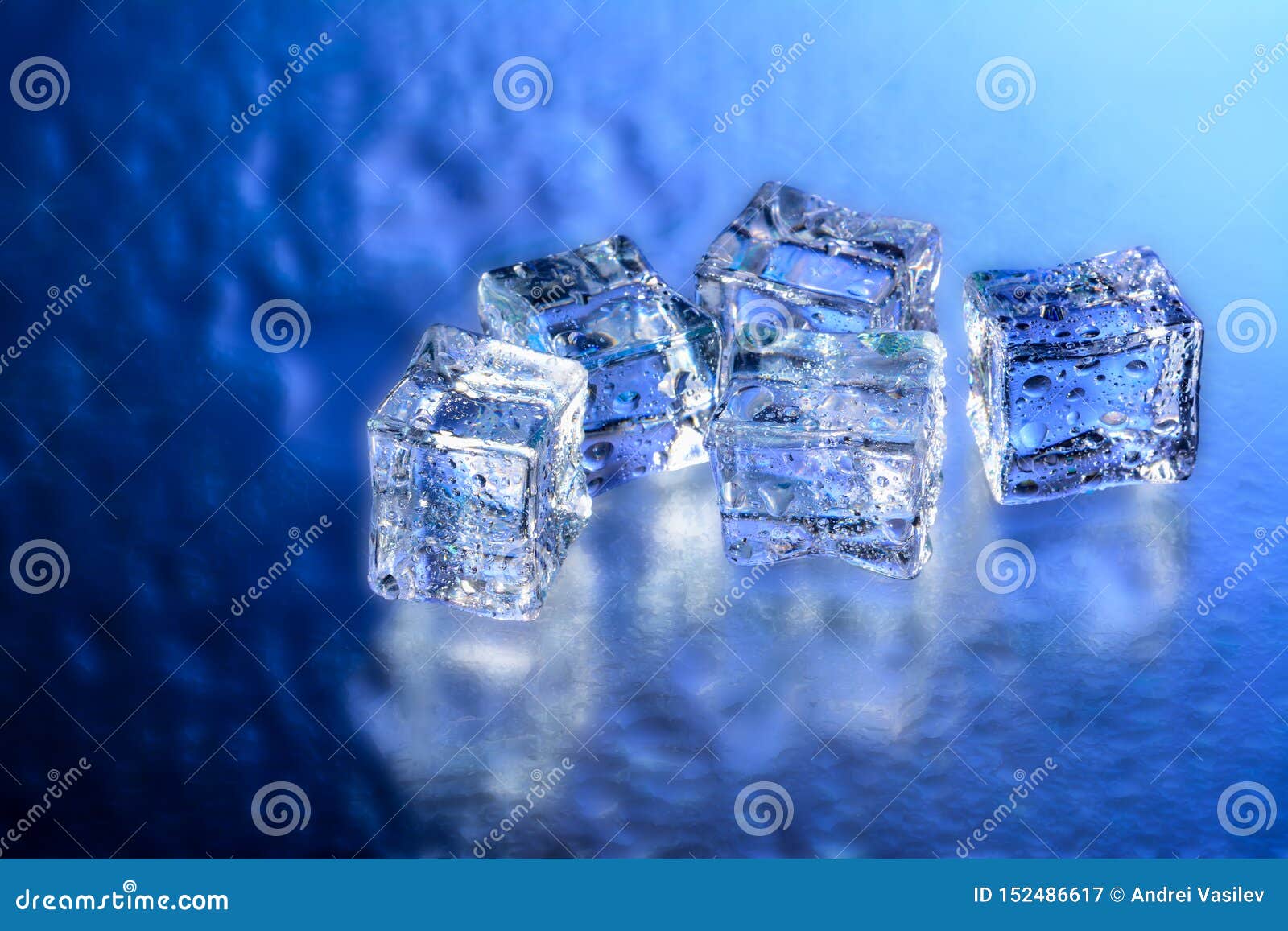 Ice Cubes in Drops of Water on a Wet Blue Surface Stock Image - Image ...