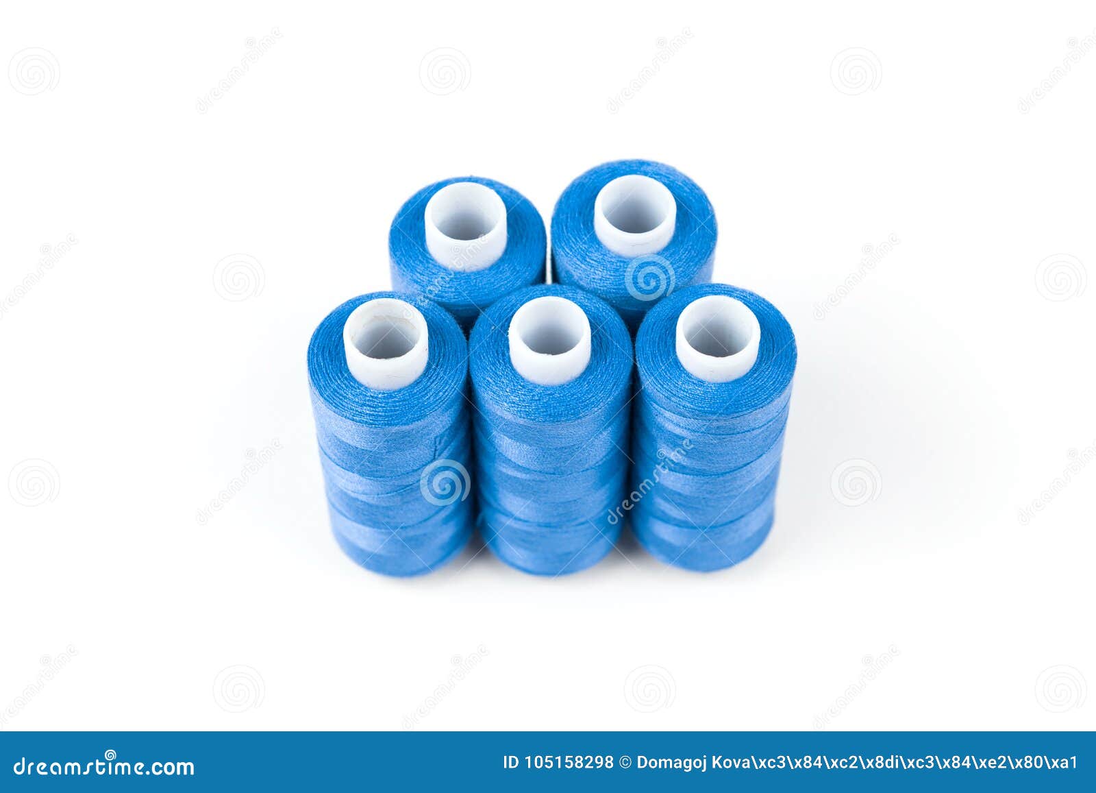 Five Light Blue Sewing Threads on a White Coils on a White Background ...