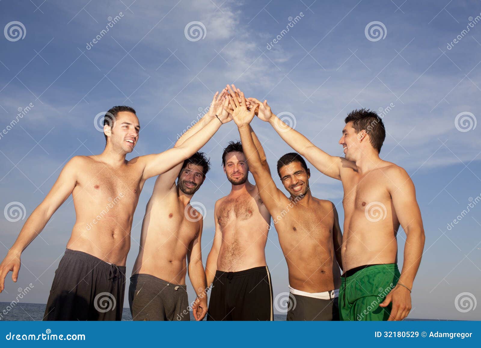Five Man Standing in a Circle Putting Hands on Stock Image - Image of ...