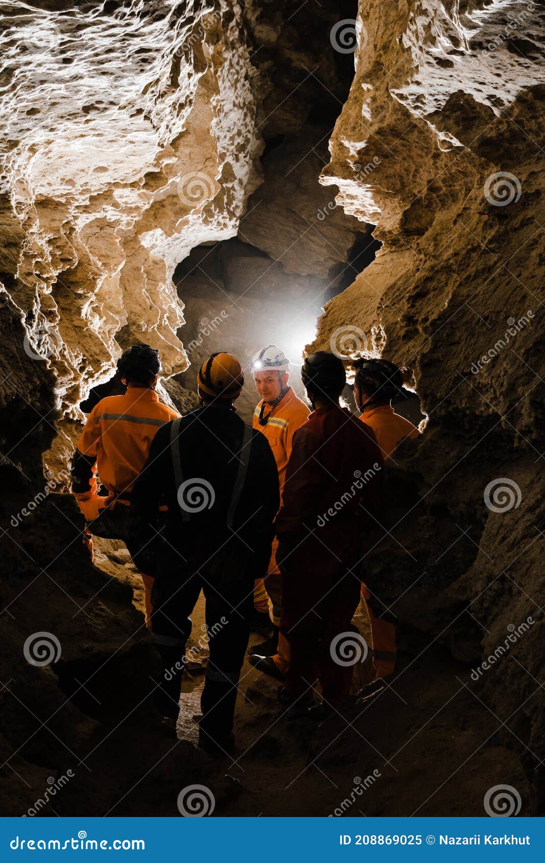 Five Men, Strong Physique, Explore the Cave. Men Dressed in Special ...