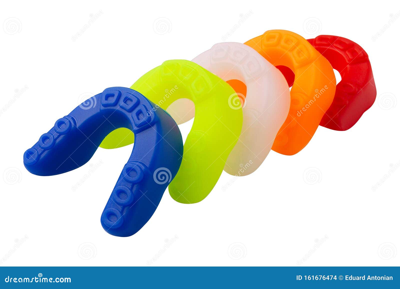 Five Multi-colored Boxing Mouth Guards for Protecting Teeth, Lie in a ...