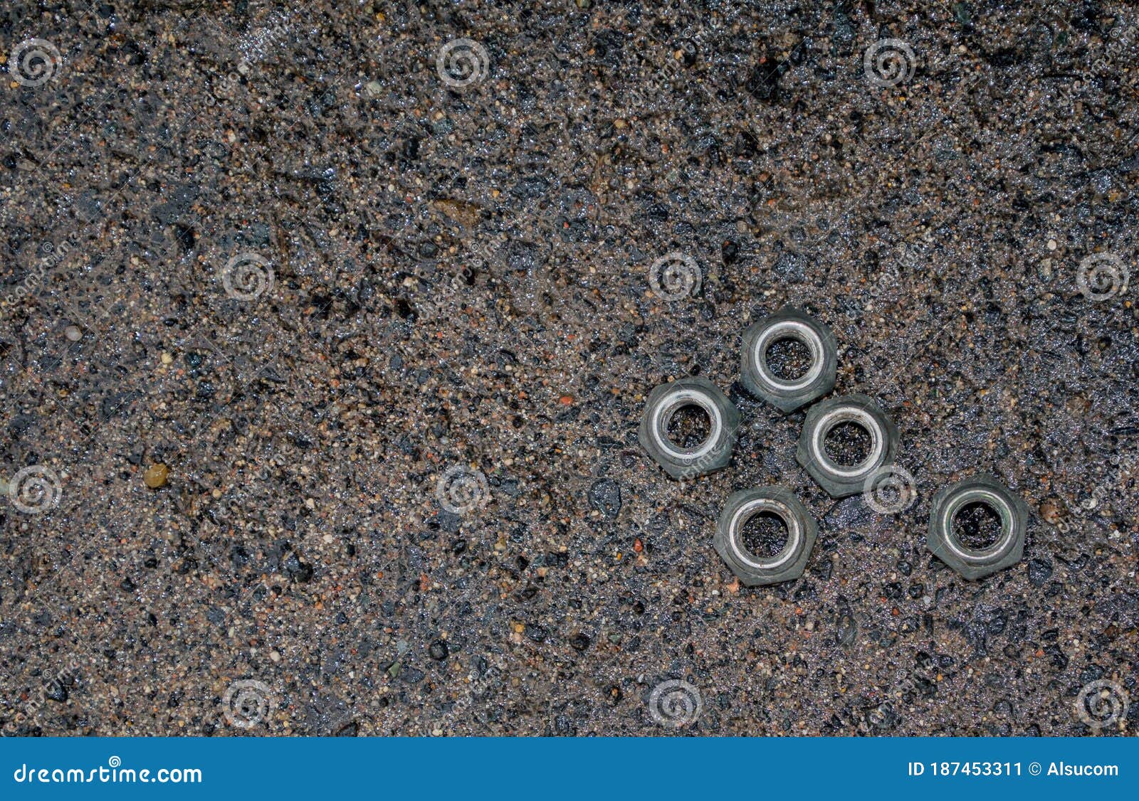 Five nuts. Wet asphalt stock image. Image of tool, element - 187453311