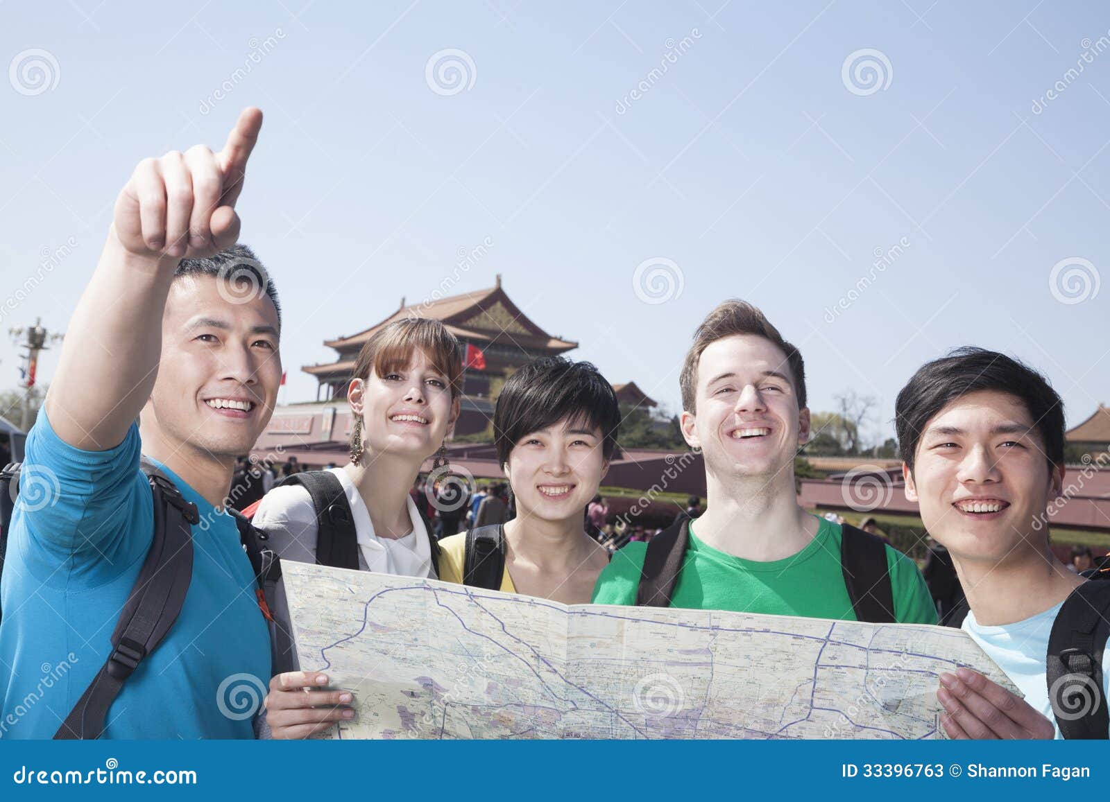 Five People Looking at Map with Tiananmen Square in Background. Stock ...