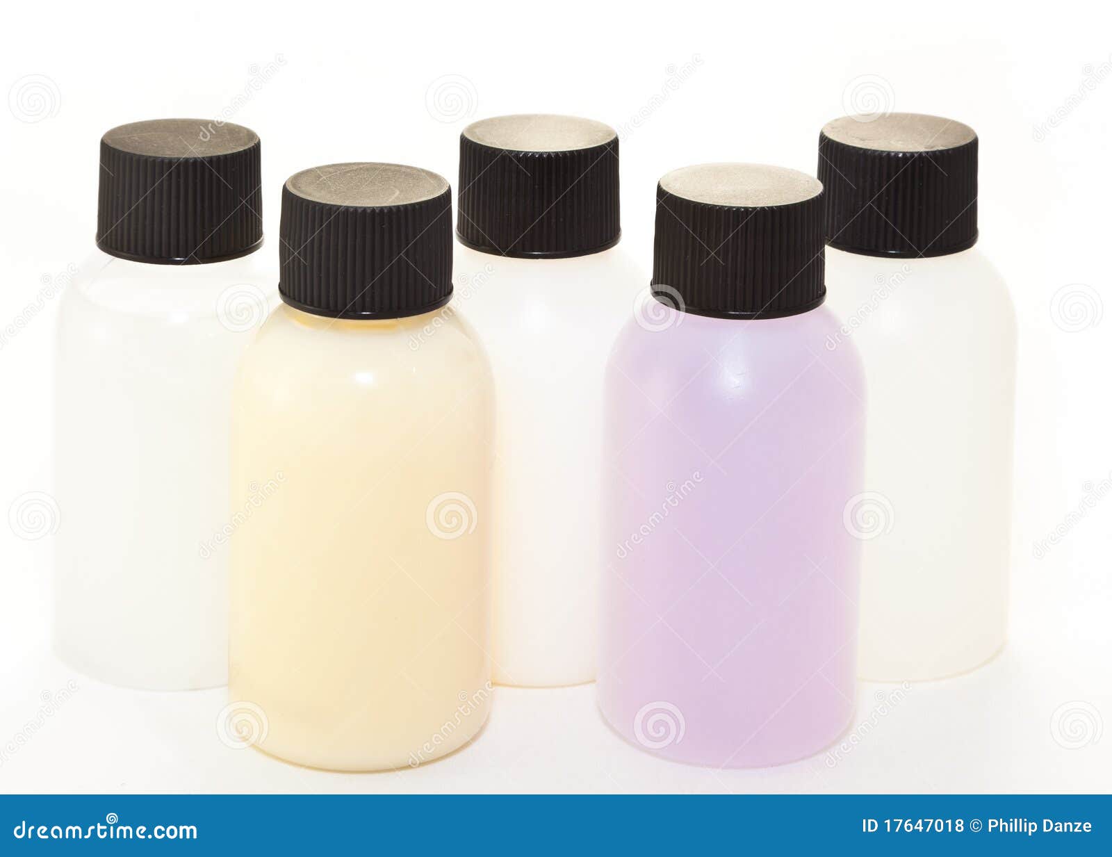 Five Plastic Bottles of Coloured Liquid Stock Photo - Image of small ...