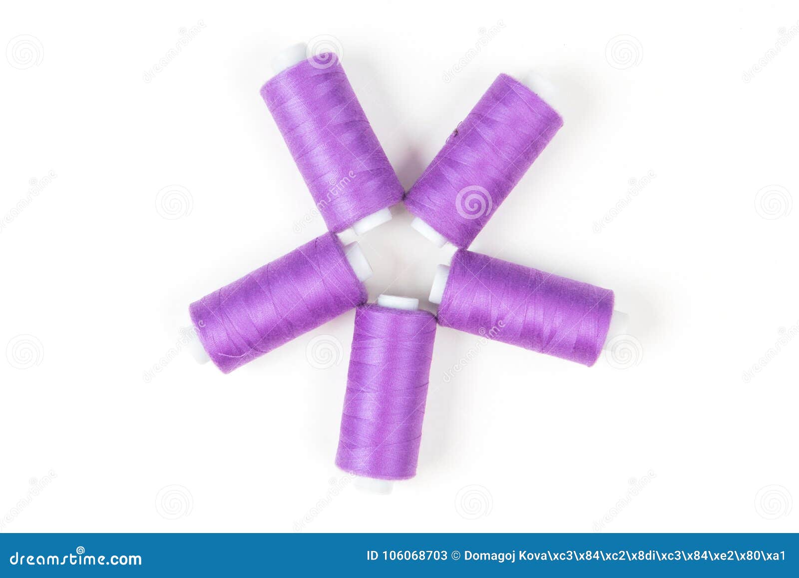 Five Purple Sewing Threads Laying in a Circle on a White Background ...