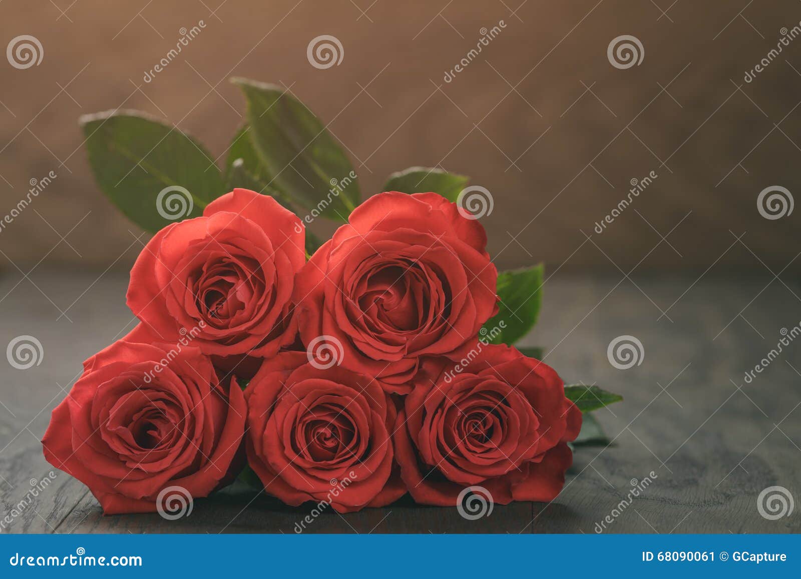 Five Red Roses on Wooden Table Stock Image - Image of green, background ...