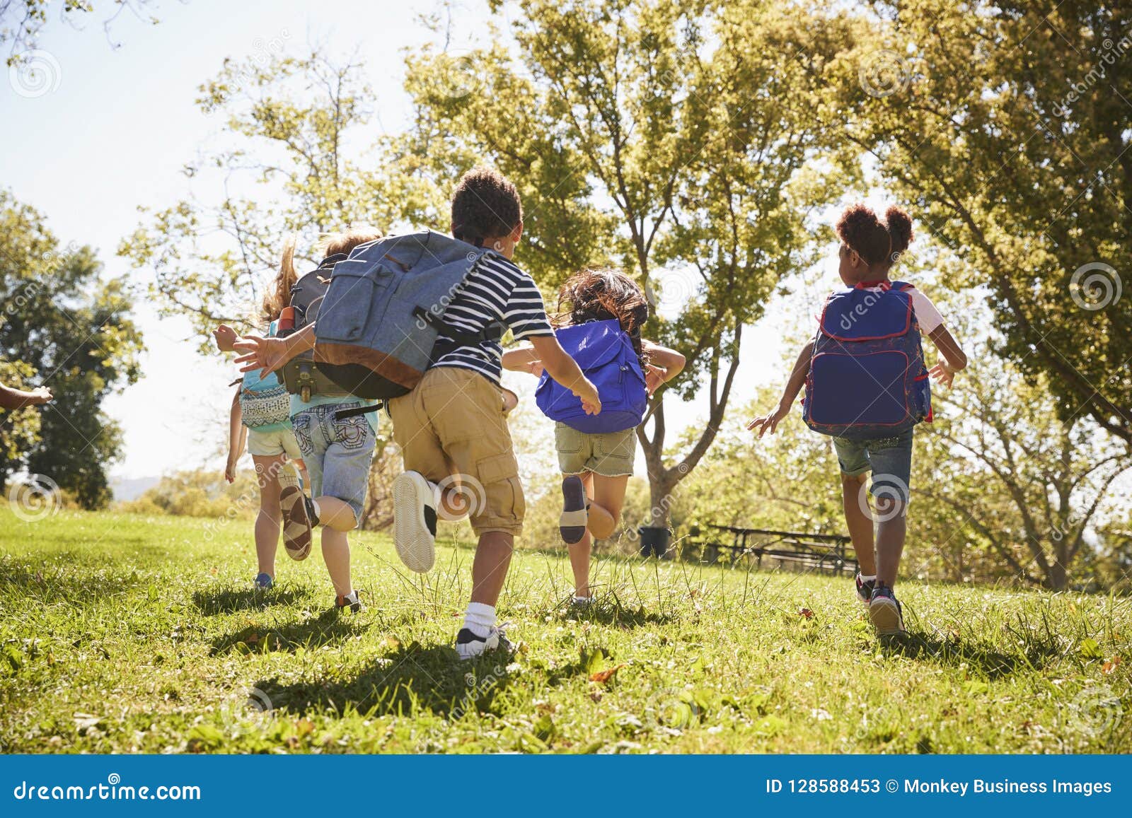 Five School Kids Running in a Field, Back View, Close Up Stock Image ...