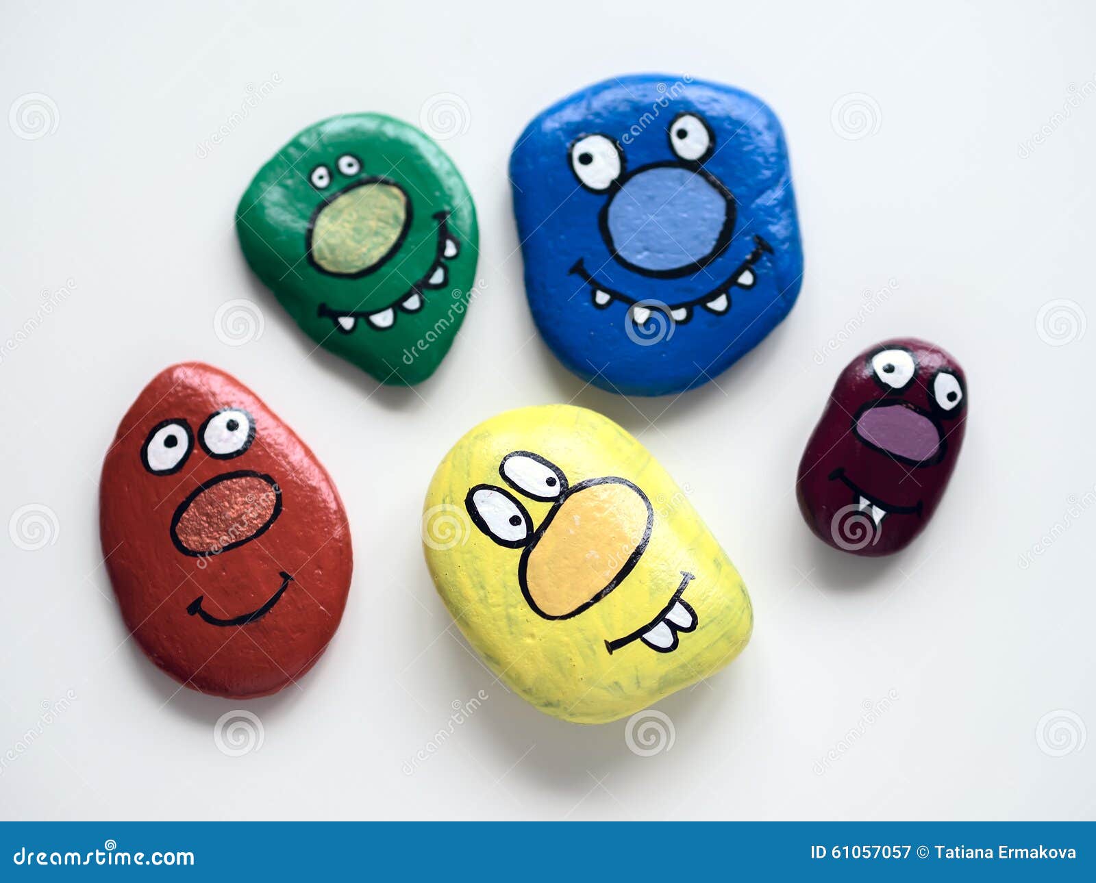 Five Smiling Faces of Monsters. Painted Acrylic Pebbles. Stock Image ...