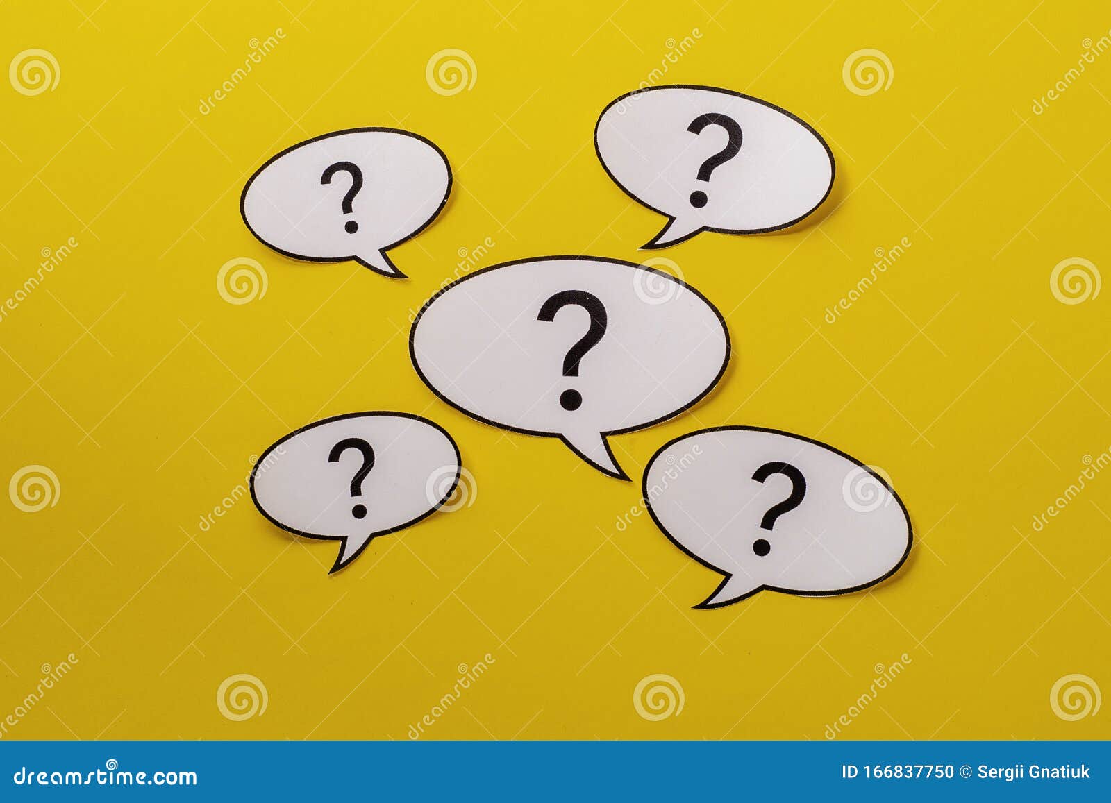 Five Speech Bubbles with Question Marks Over a Bright Yellow Background ...