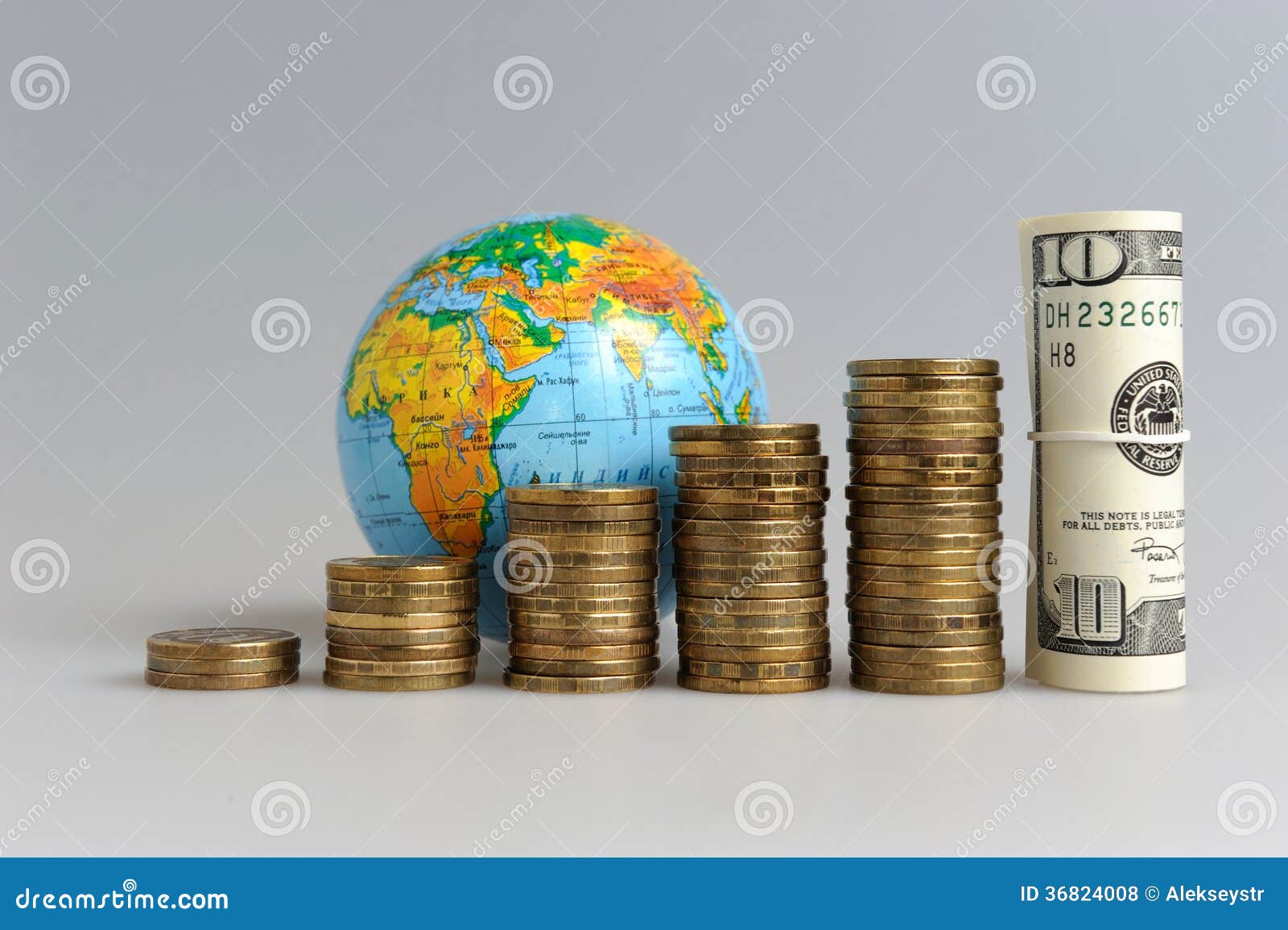 Five Stacks of Coins with a Globe and a Bundle of Dollars Stock Photo ...
