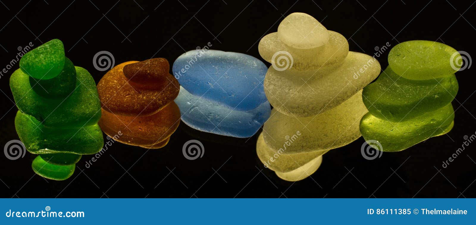 Five Stacks of Sea Glass Pebbles Reflected in a Mirror Stock Image ...