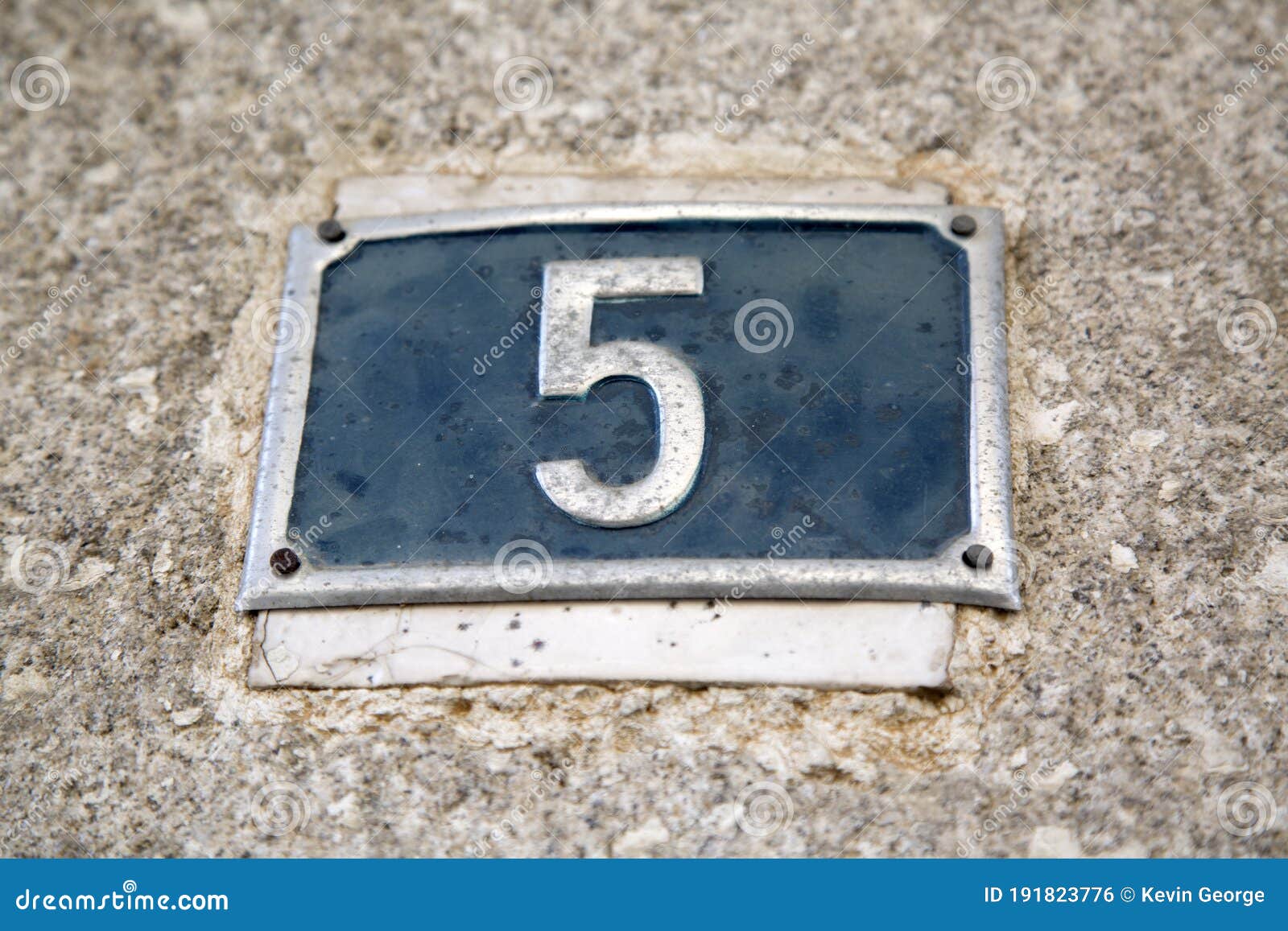 Five on Stone Wall stock photo. Image of number, home - 191823776