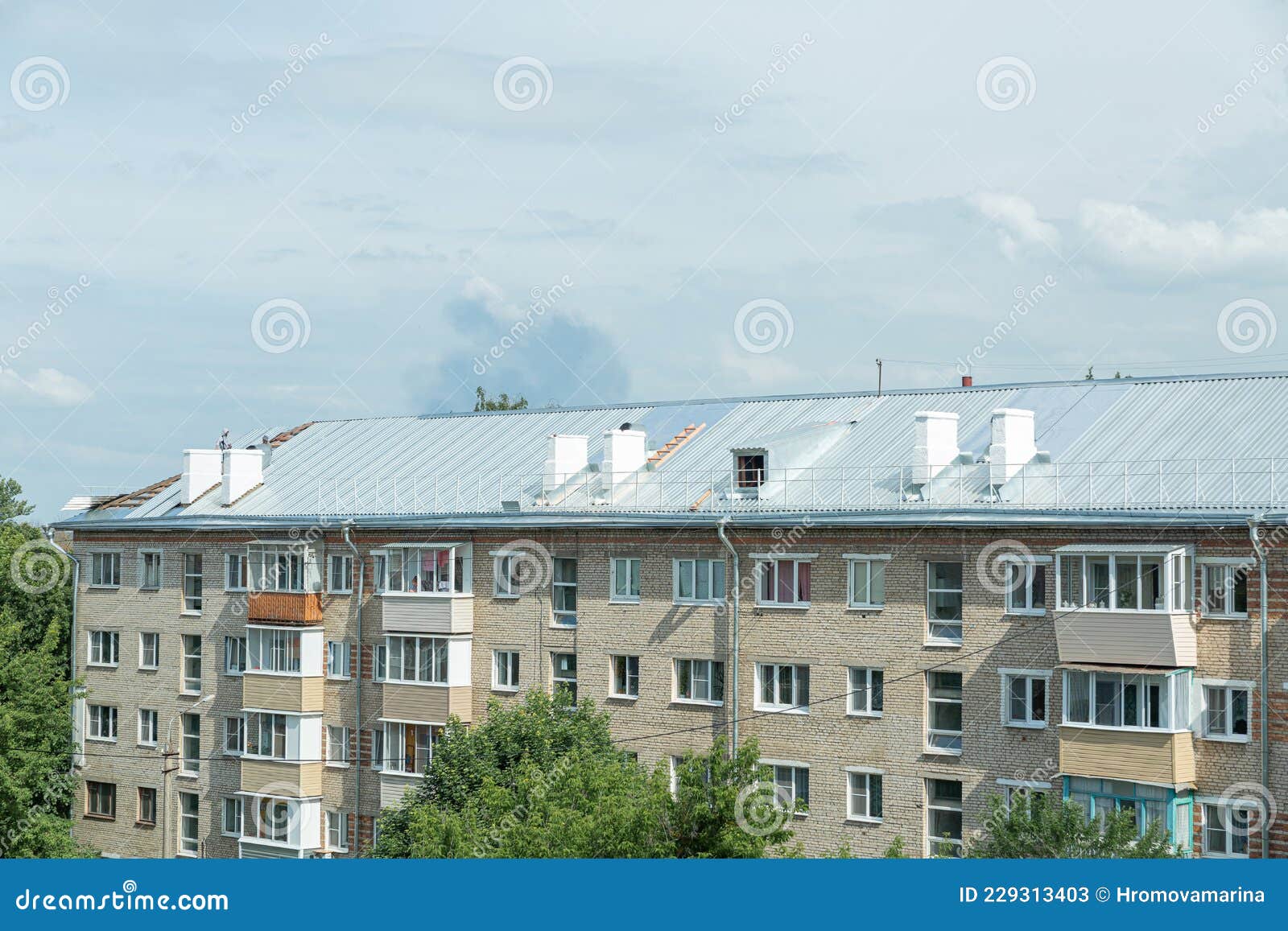 A Five-storey Building with a New Roof Replaced by a Profiled Sheet ...