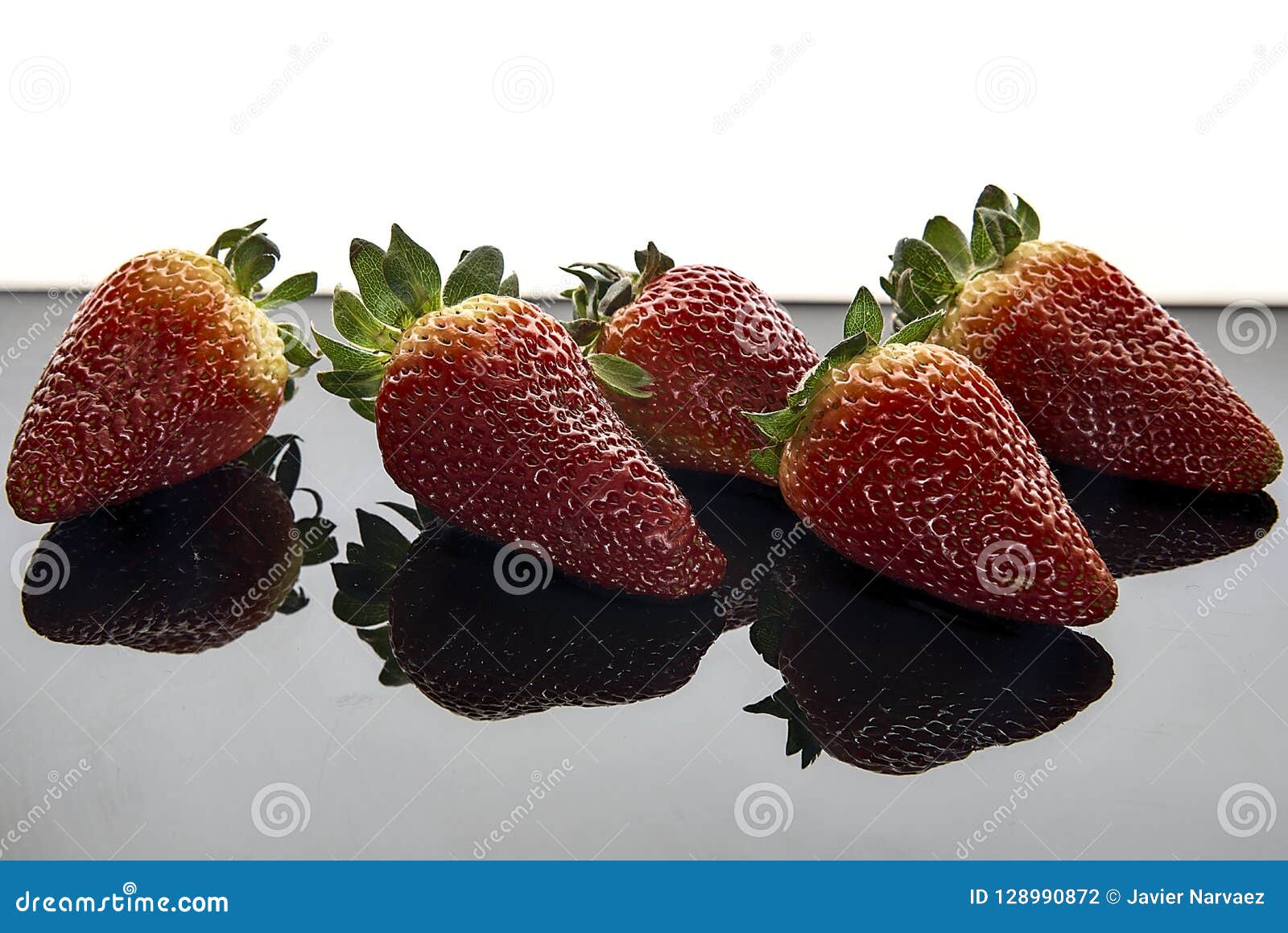 Five Strawberries in the Foreground Stock Photo - Image of food ...