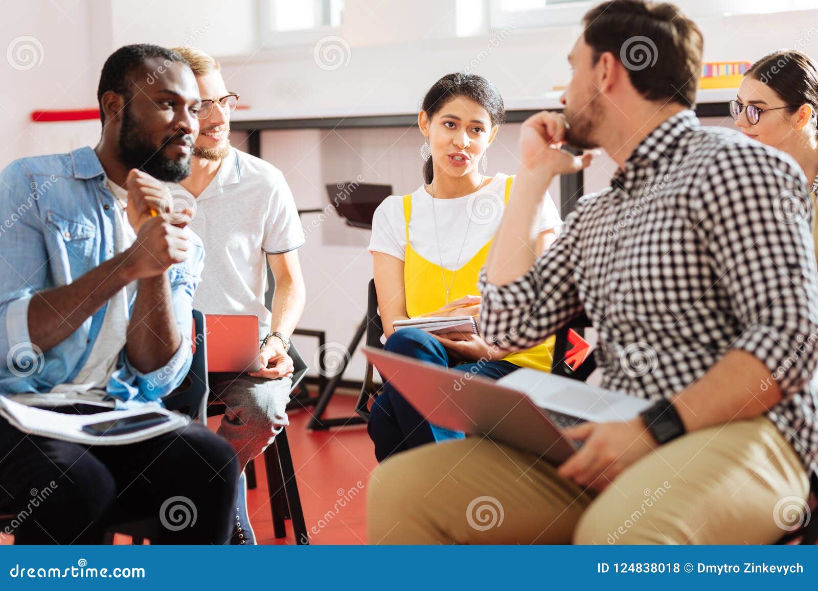 Five Students Turning To Each Other and Having Interesting Talk Stock ...